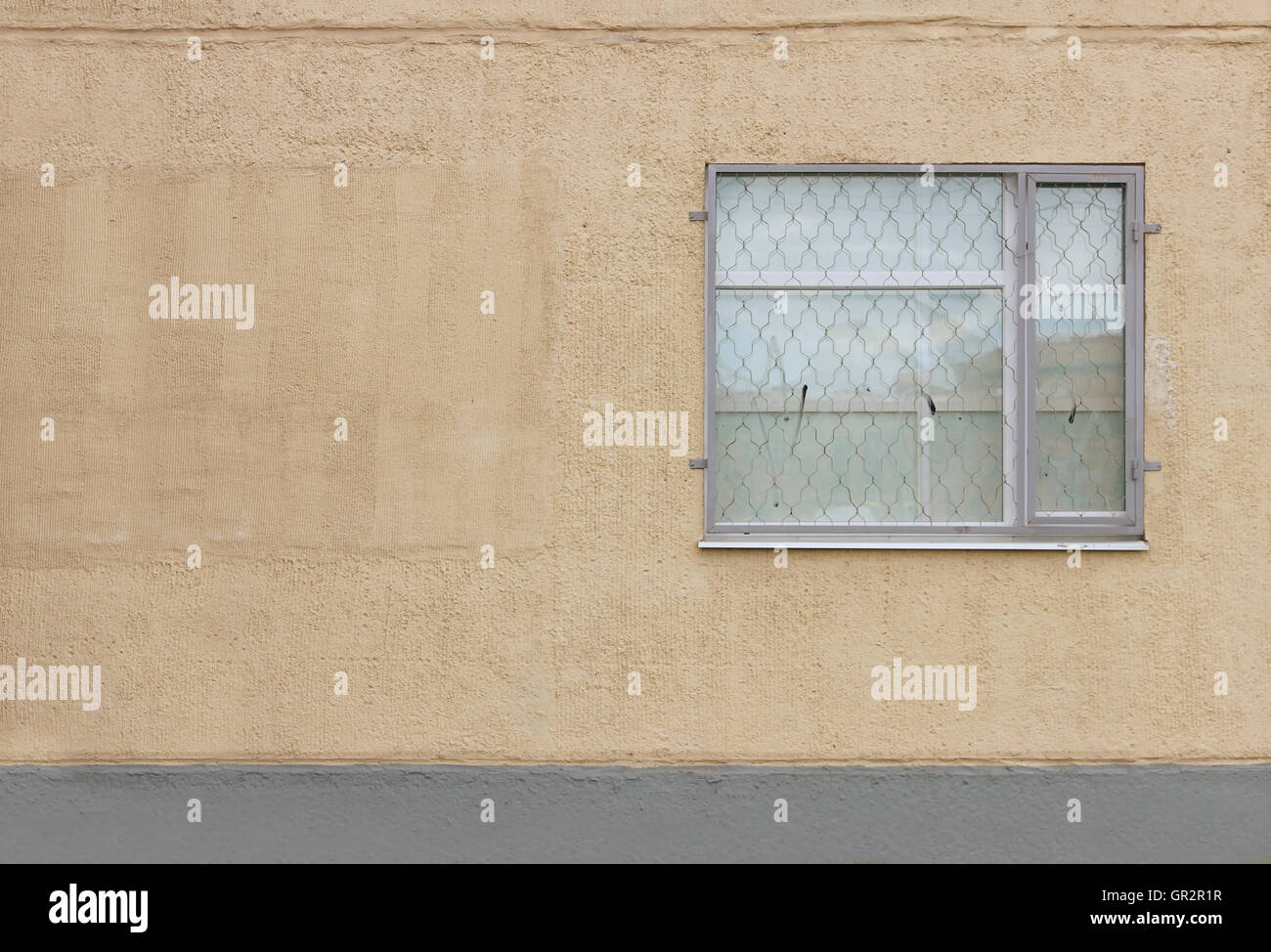 one gray window with a safety guard on the first floor of a modern ...