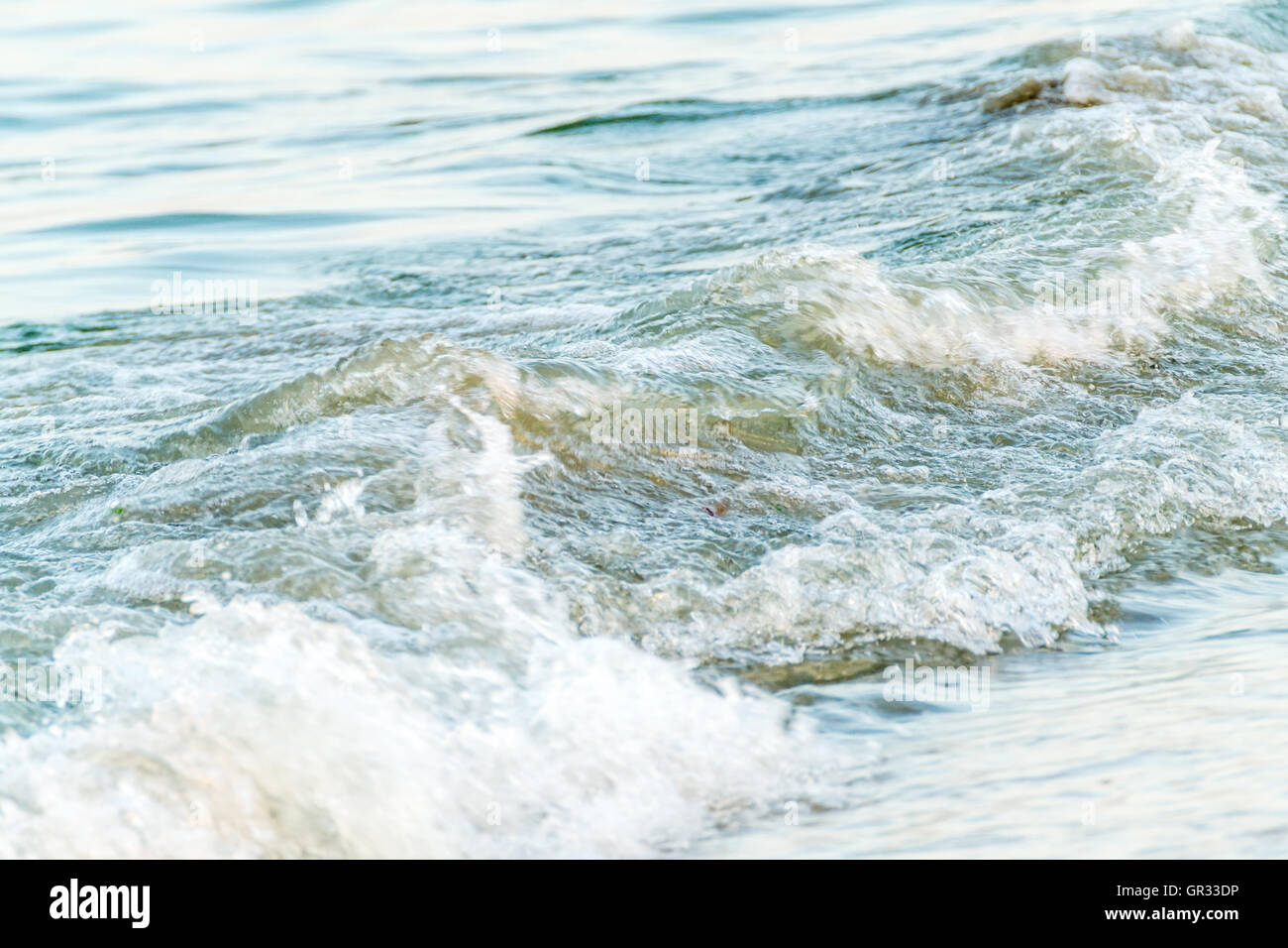 Water hitting shore Stock Photo - Alamy