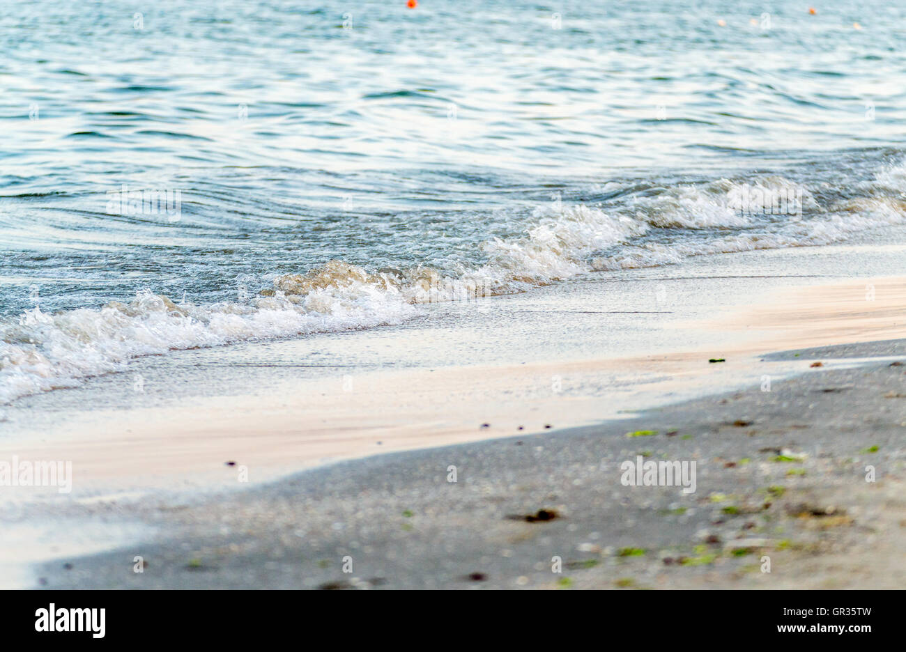 Water hitting shore Stock Photo - Alamy