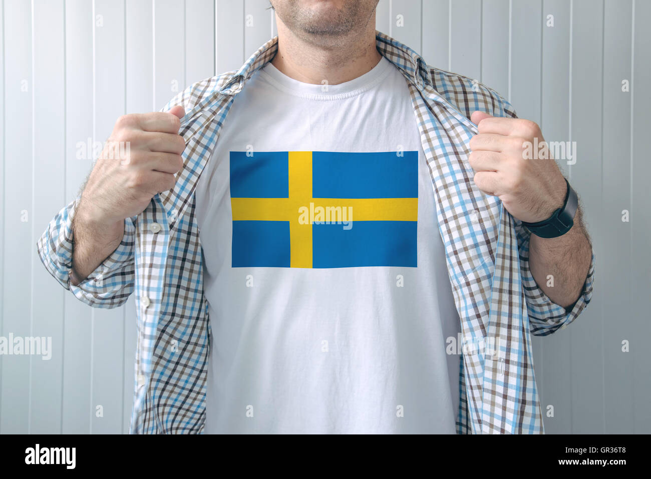 Man wearing white shirt with Swedish flag print, adult male person ...