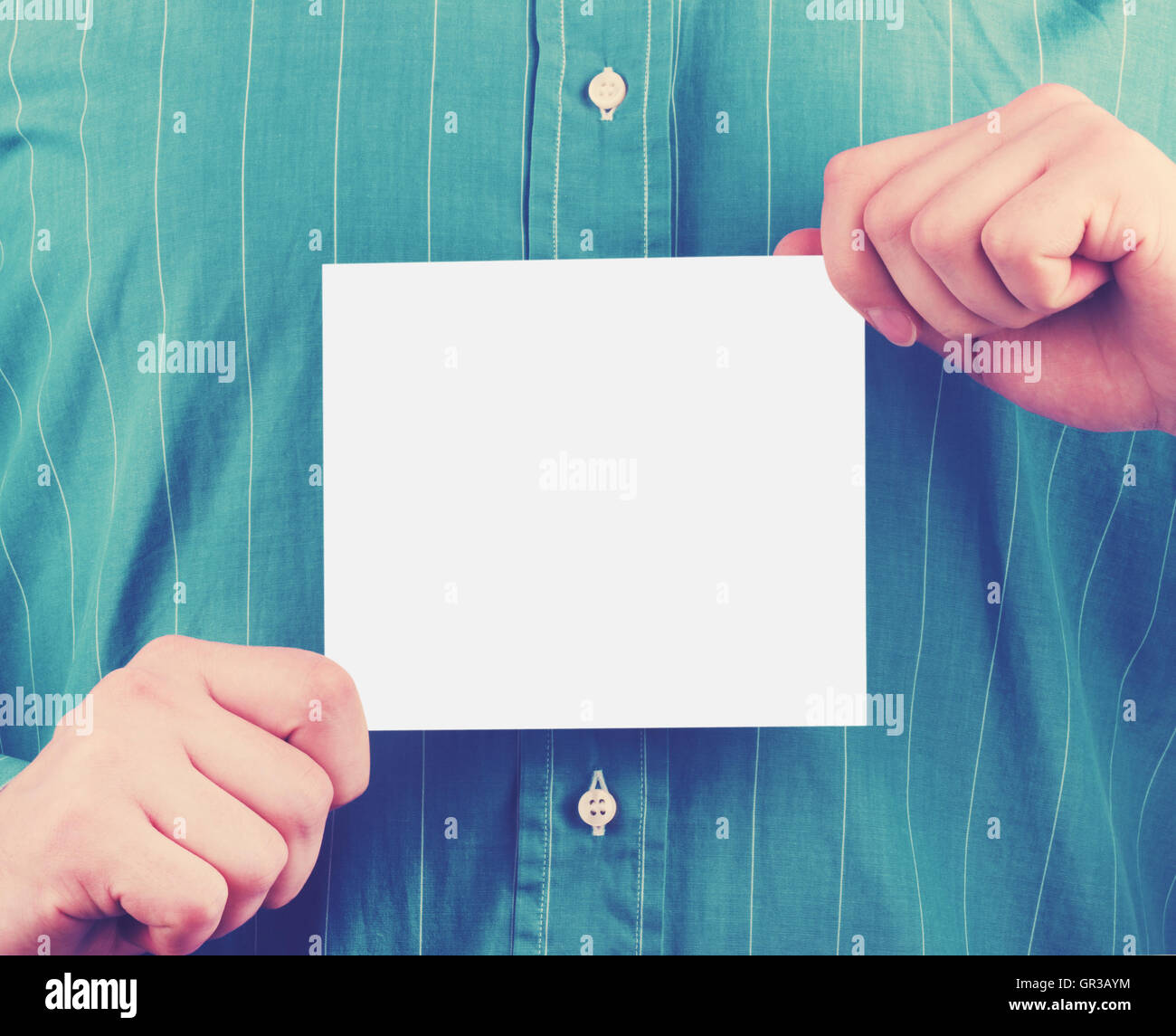 Closeup of businessman's hand holding up card Stock Photo - Alamy