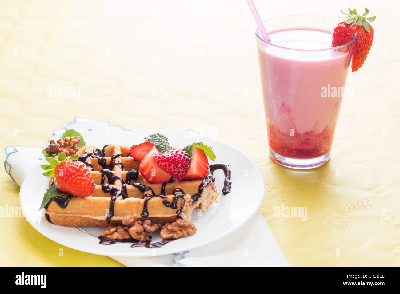 Closeup of fresh waffle with strawberry milkshake Stock Photo - Alamy