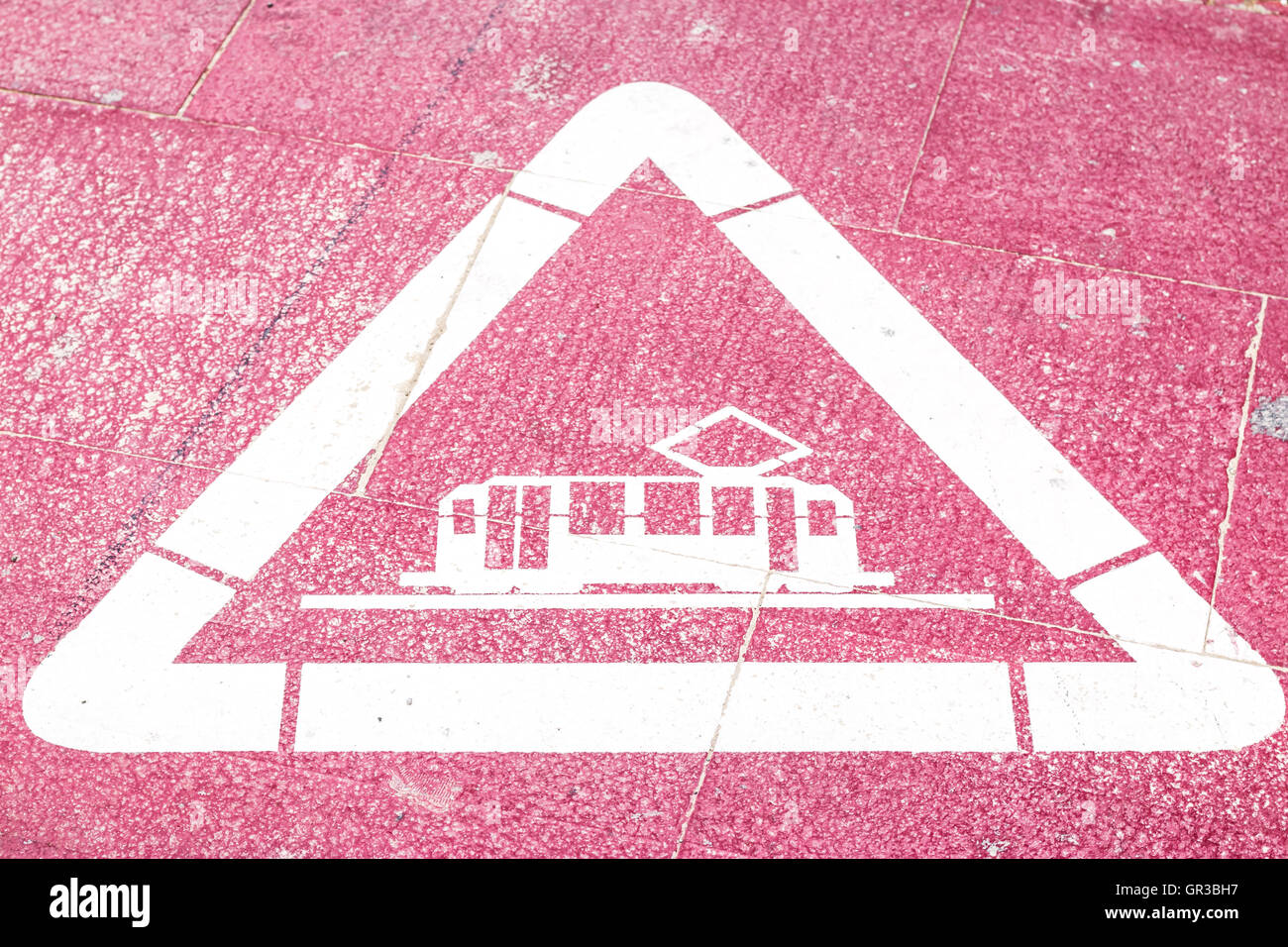 Caution metro sign on a red floor Stock Photo - Alamy