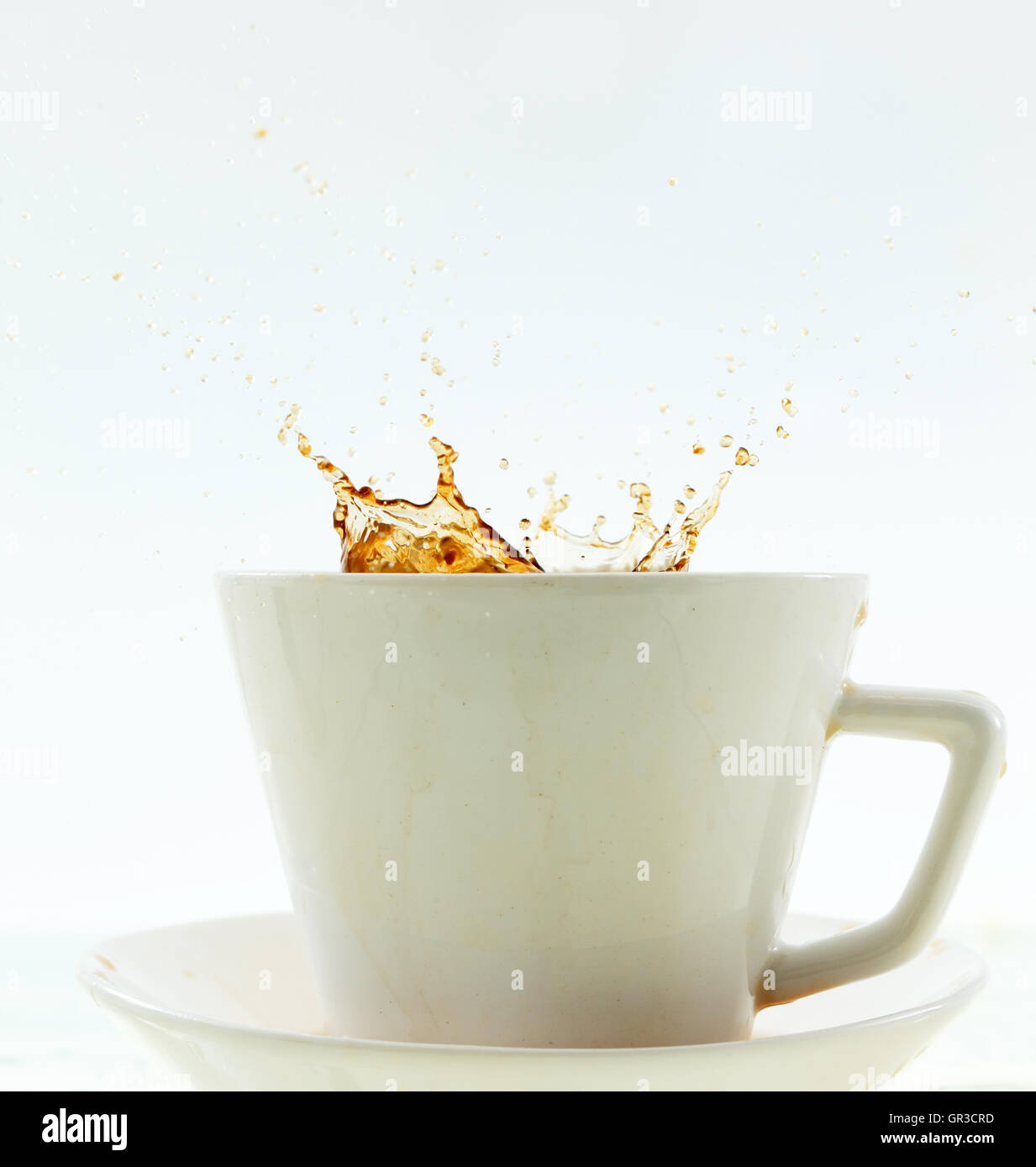 Coffee crown splash in mug Stock Photo - Alamy