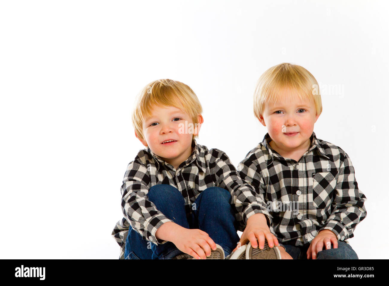 Two kids sit isolated hi-res stock photography and images - Alamy