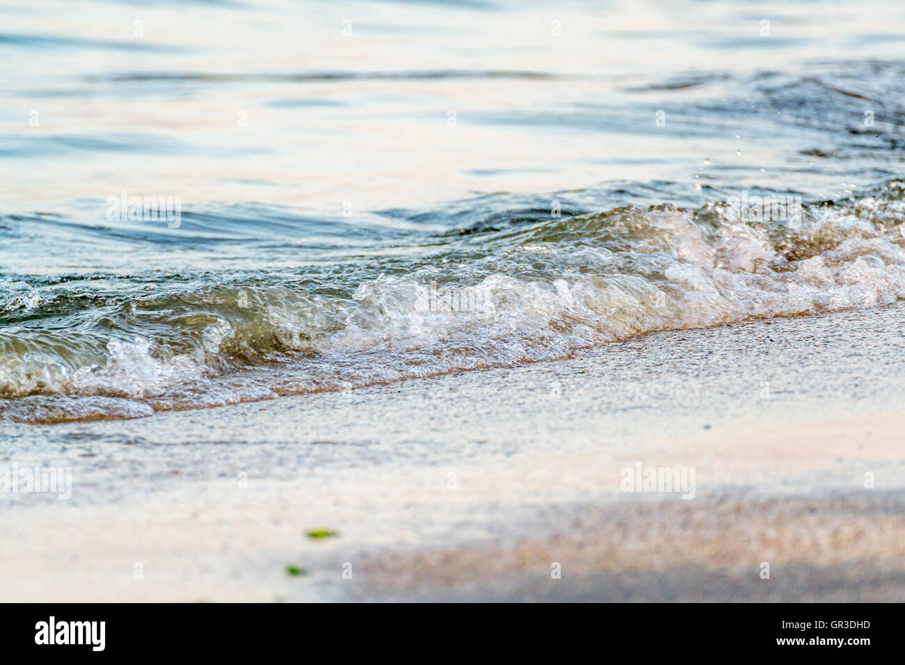 Water hitting shore Stock Photo - Alamy