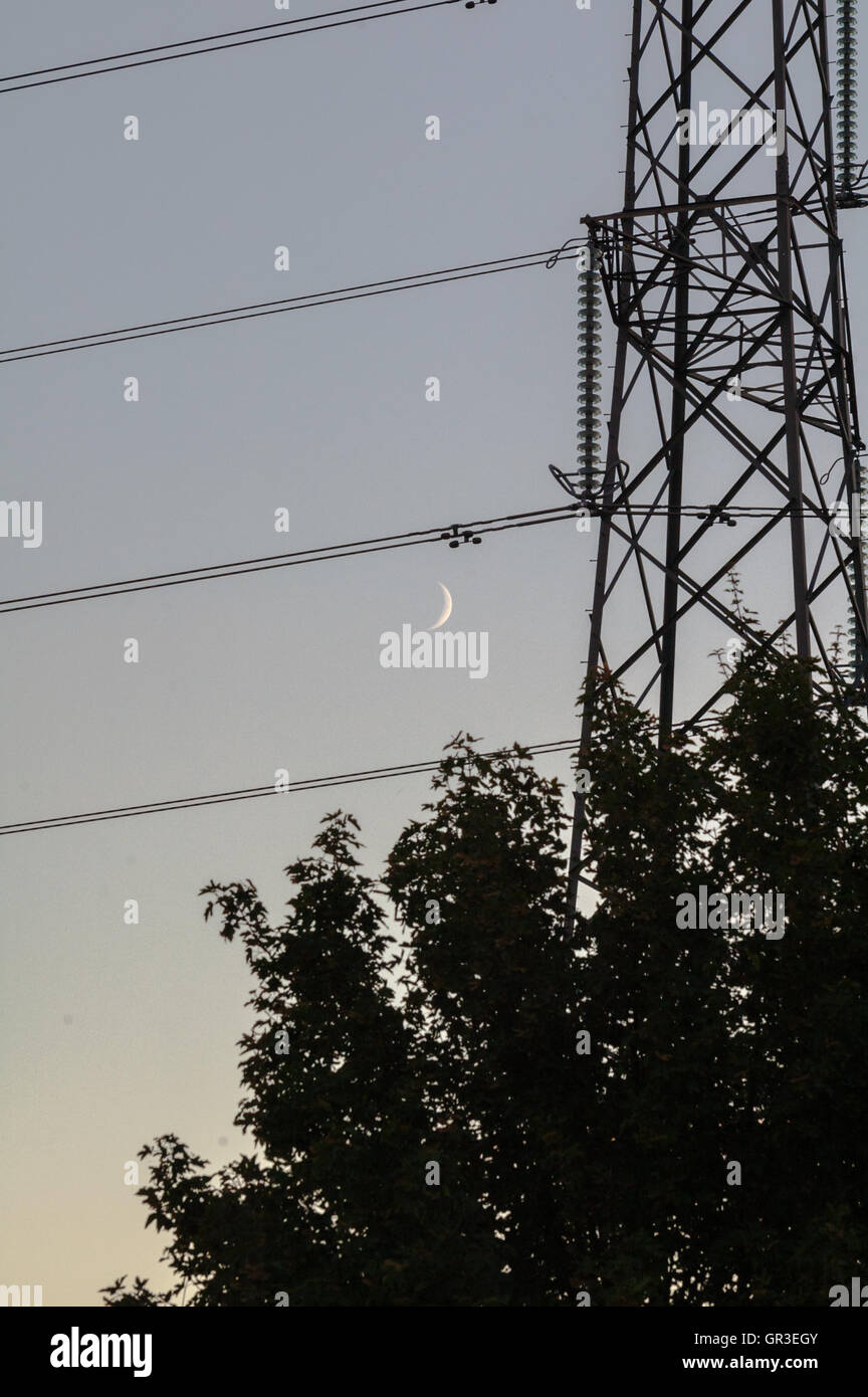 Power lines and crescent moon Stock Photo - Alamy