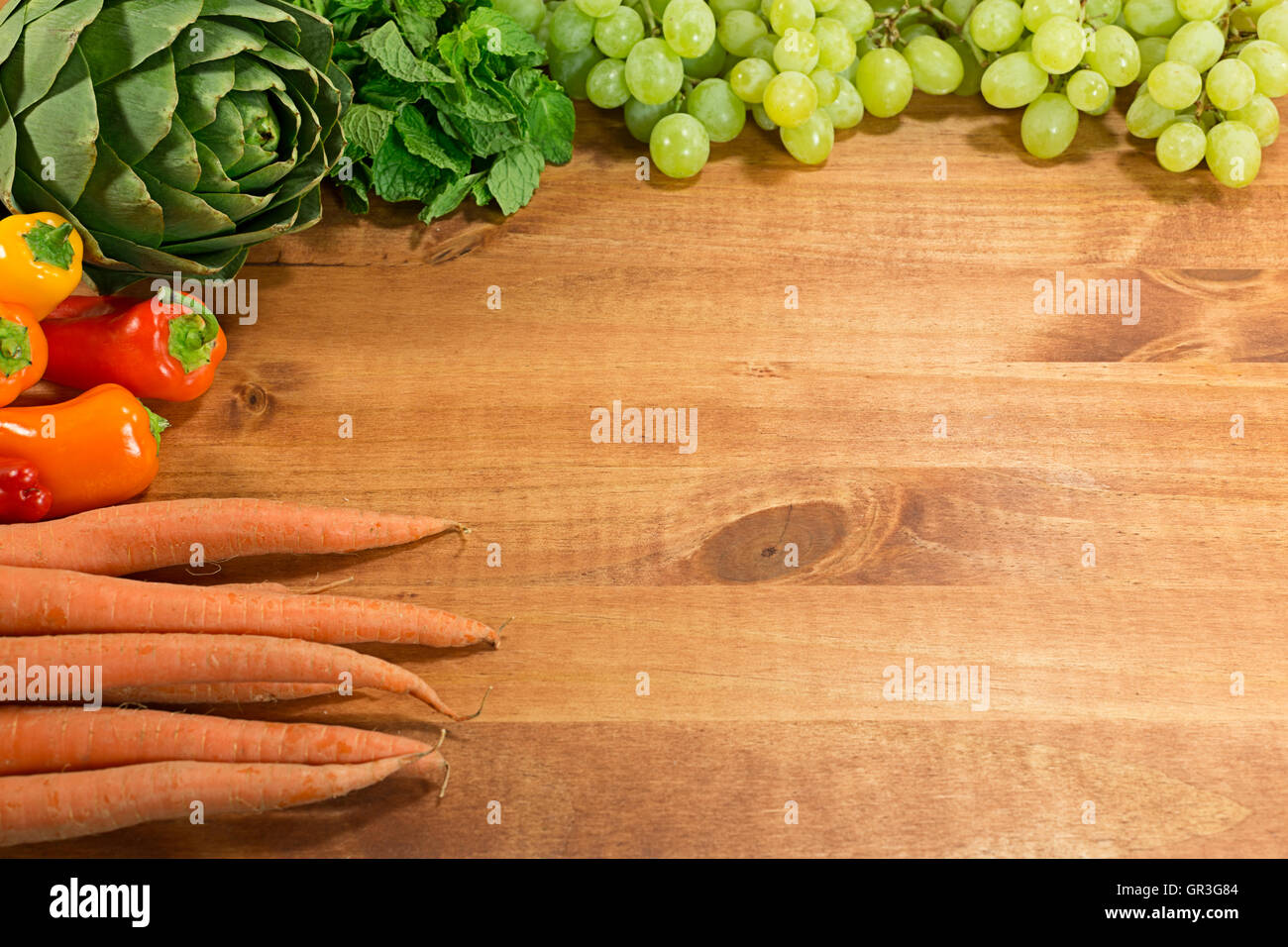 Different types of produce times placed on wood table Stock Photo - Alamy