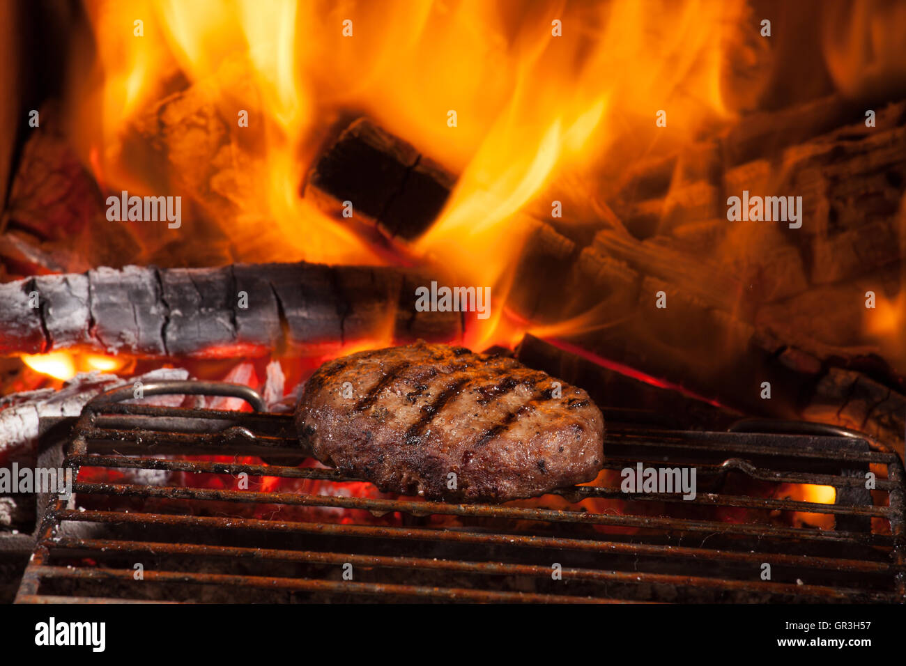 Beef burger with fire Stock Photo - Alamy