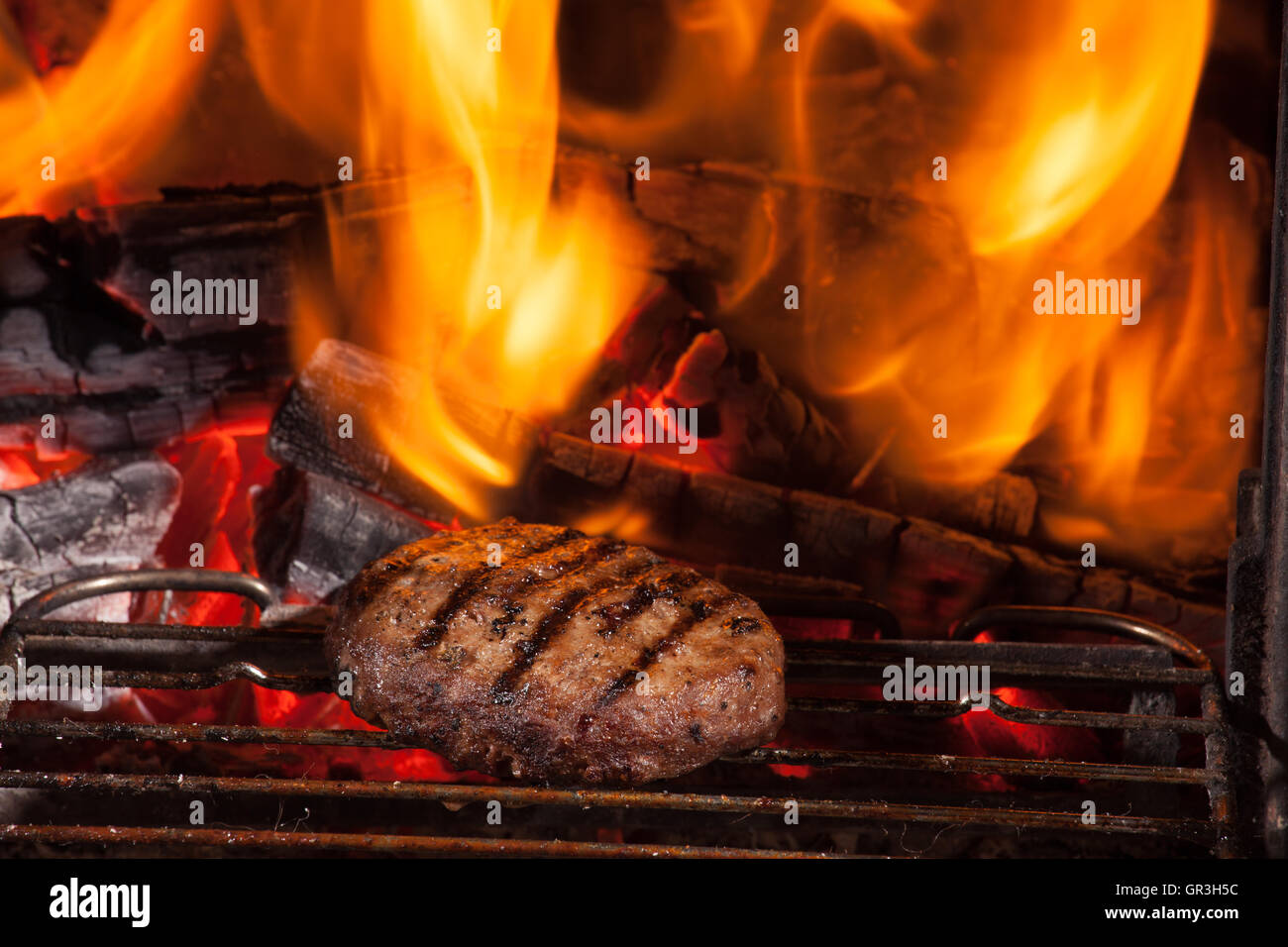 Beef burger with fire Stock Photo - Alamy