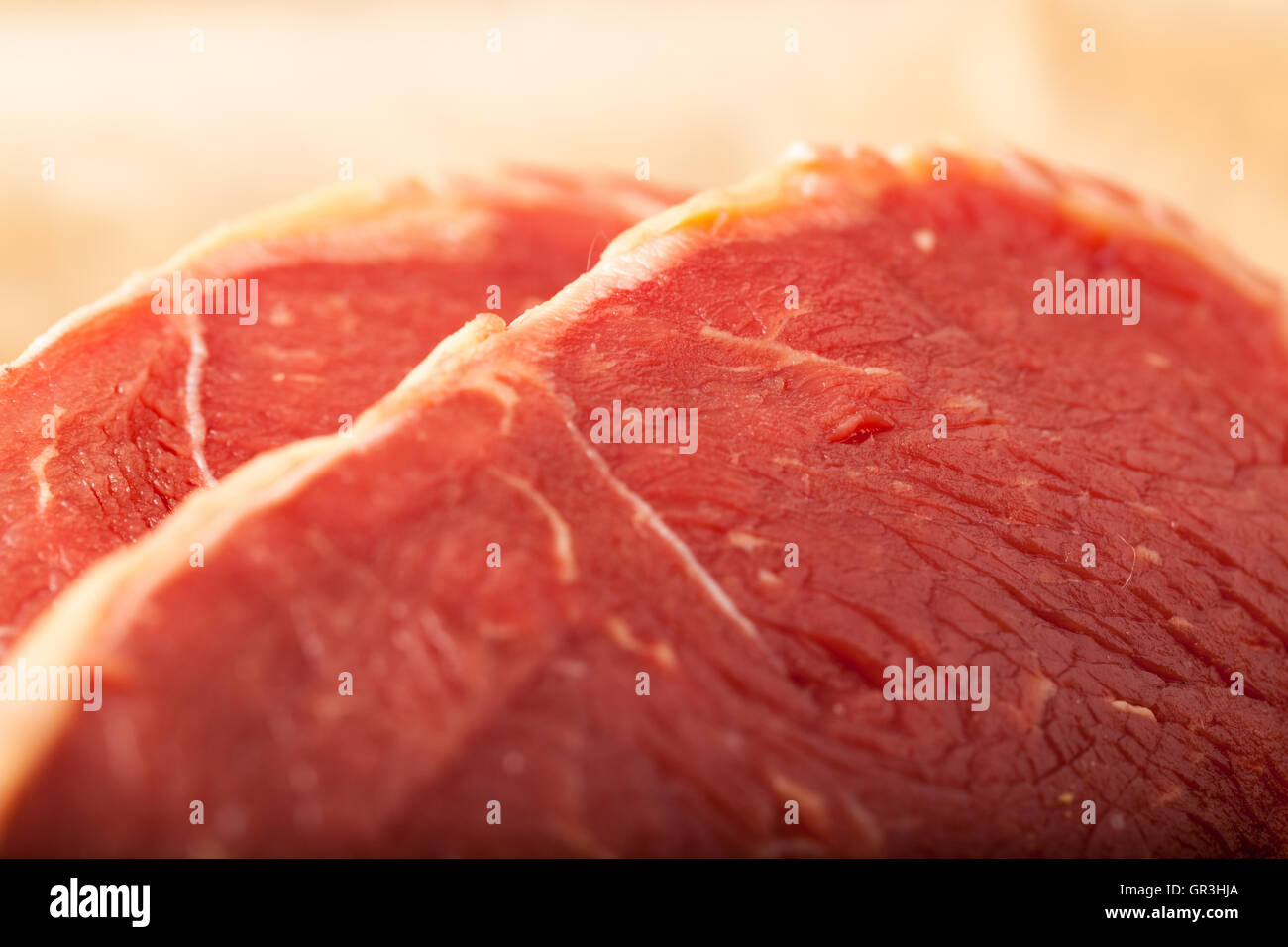 Two Beef Sirloin Steaks on Wooden Board Stock Photo - Alamy