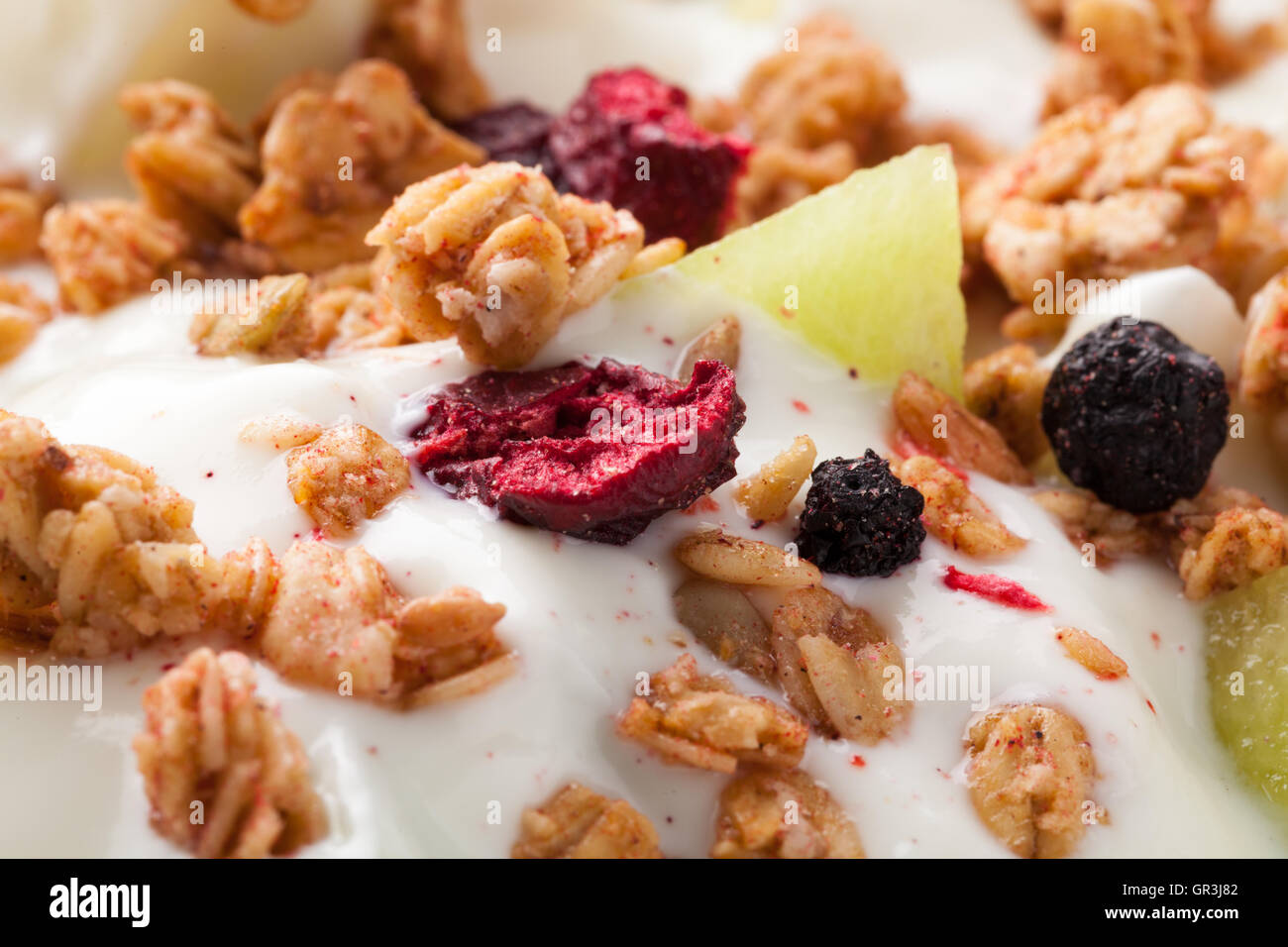 Granola topping on yogurt and fruit Stock Photo - Alamy
