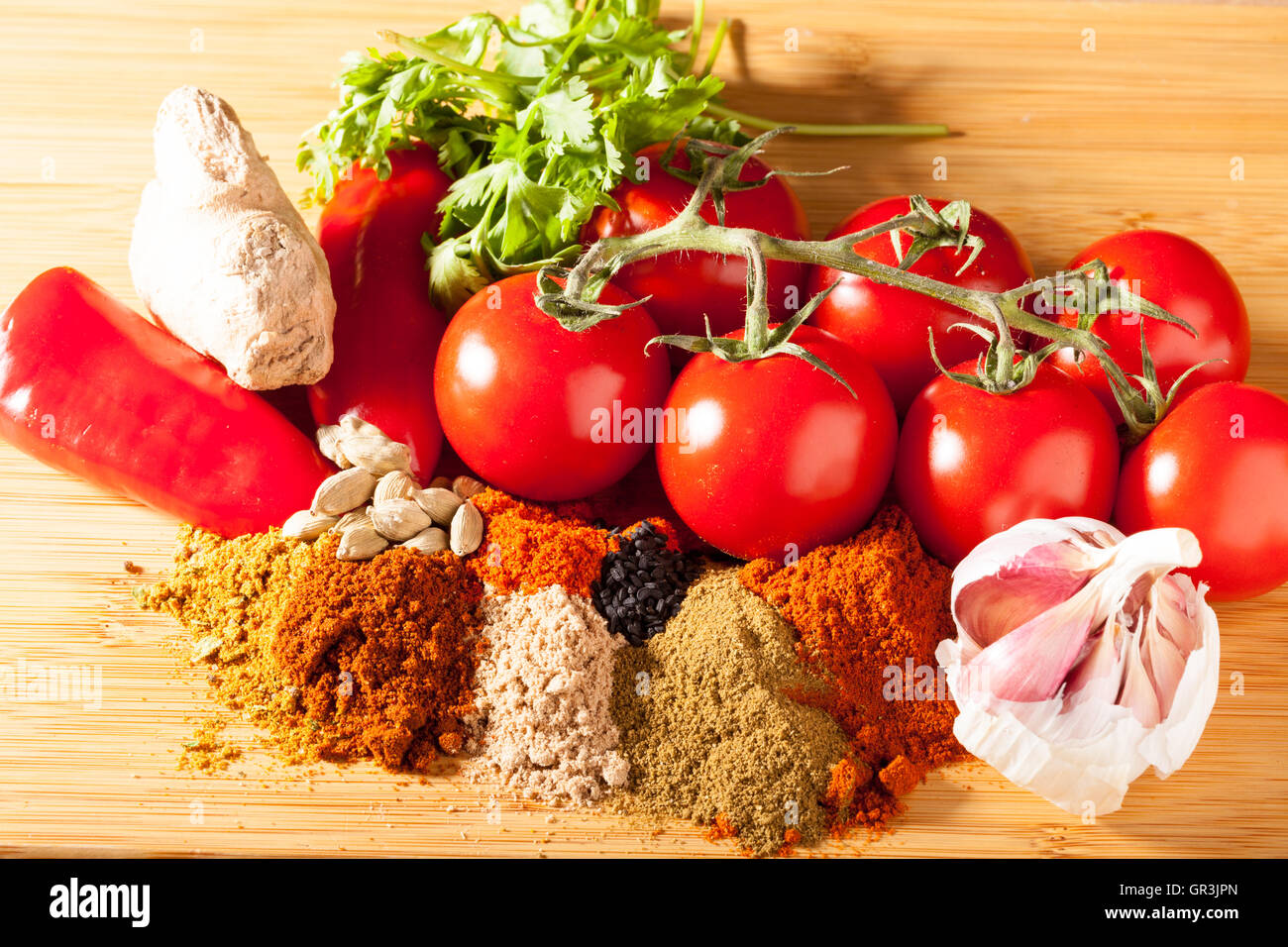 Tomato and spices ingredients for Indian cooking Stock Photo - Alamy
