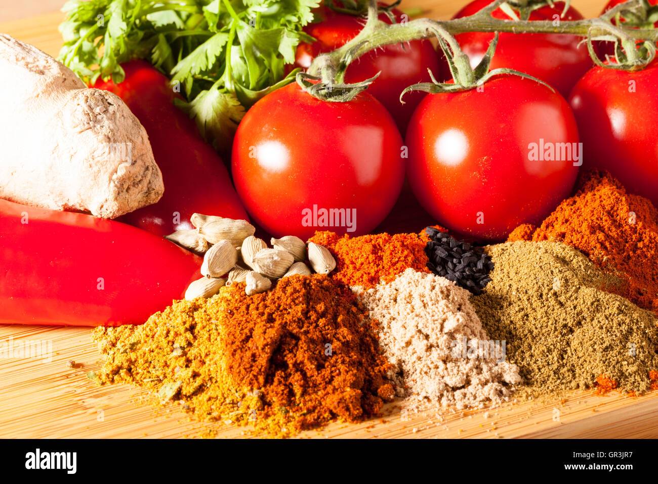 Tomato and spices ingredients for Indian cooking Stock Photo - Alamy