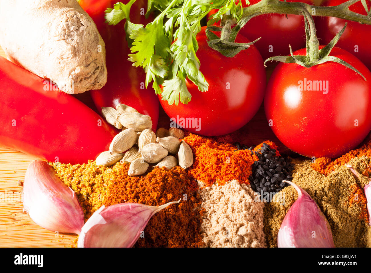 Tomato and spices ingredients for Indian cooking Stock Photo - Alamy
