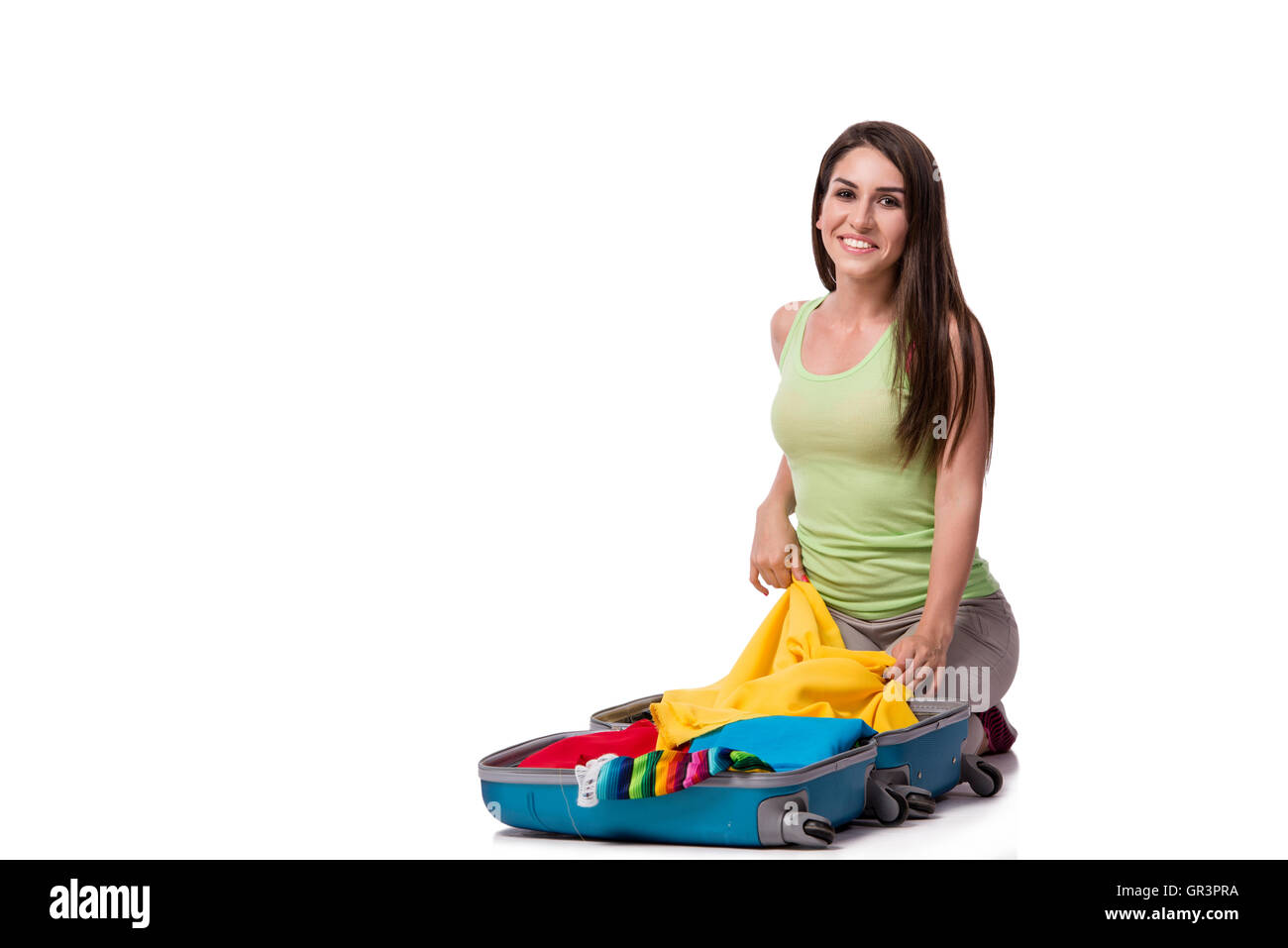 Woman packing preparing for summer vacation isolated on white Stock ...