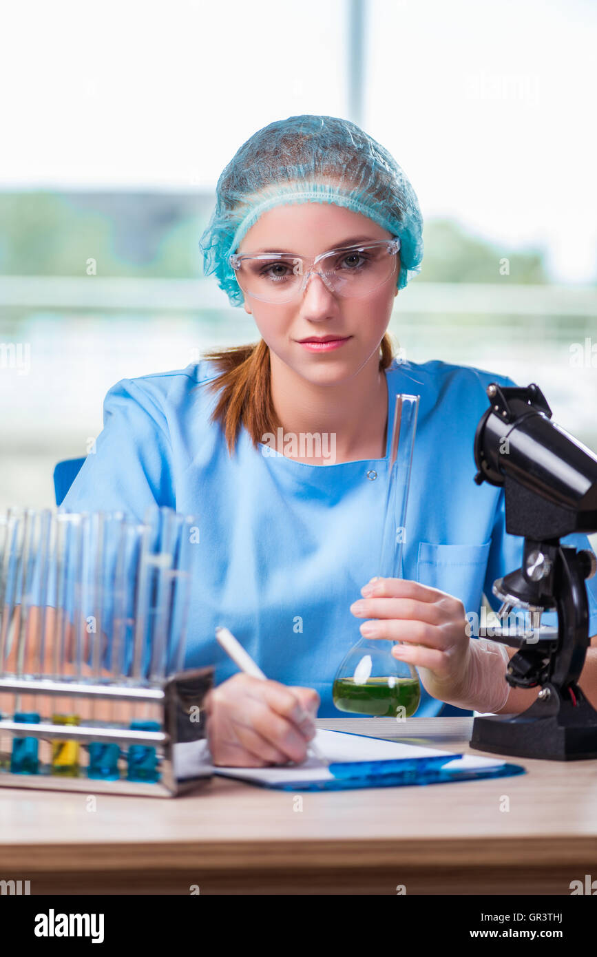 Young student working with chemical solutions in lab Stock Photo - Alamy
