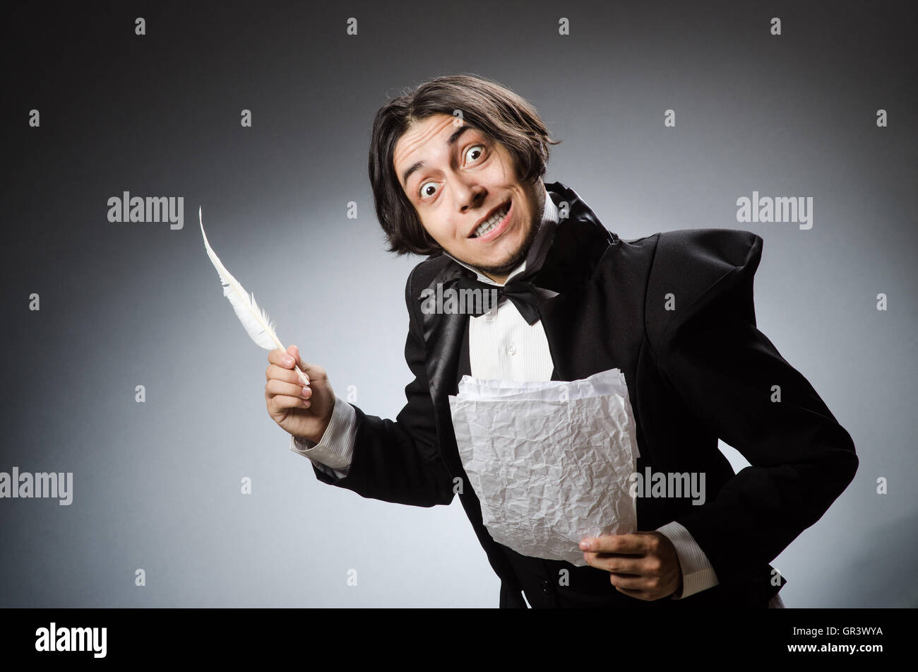 Funny writer with quill in vintage concept Stock Photo - Alamy