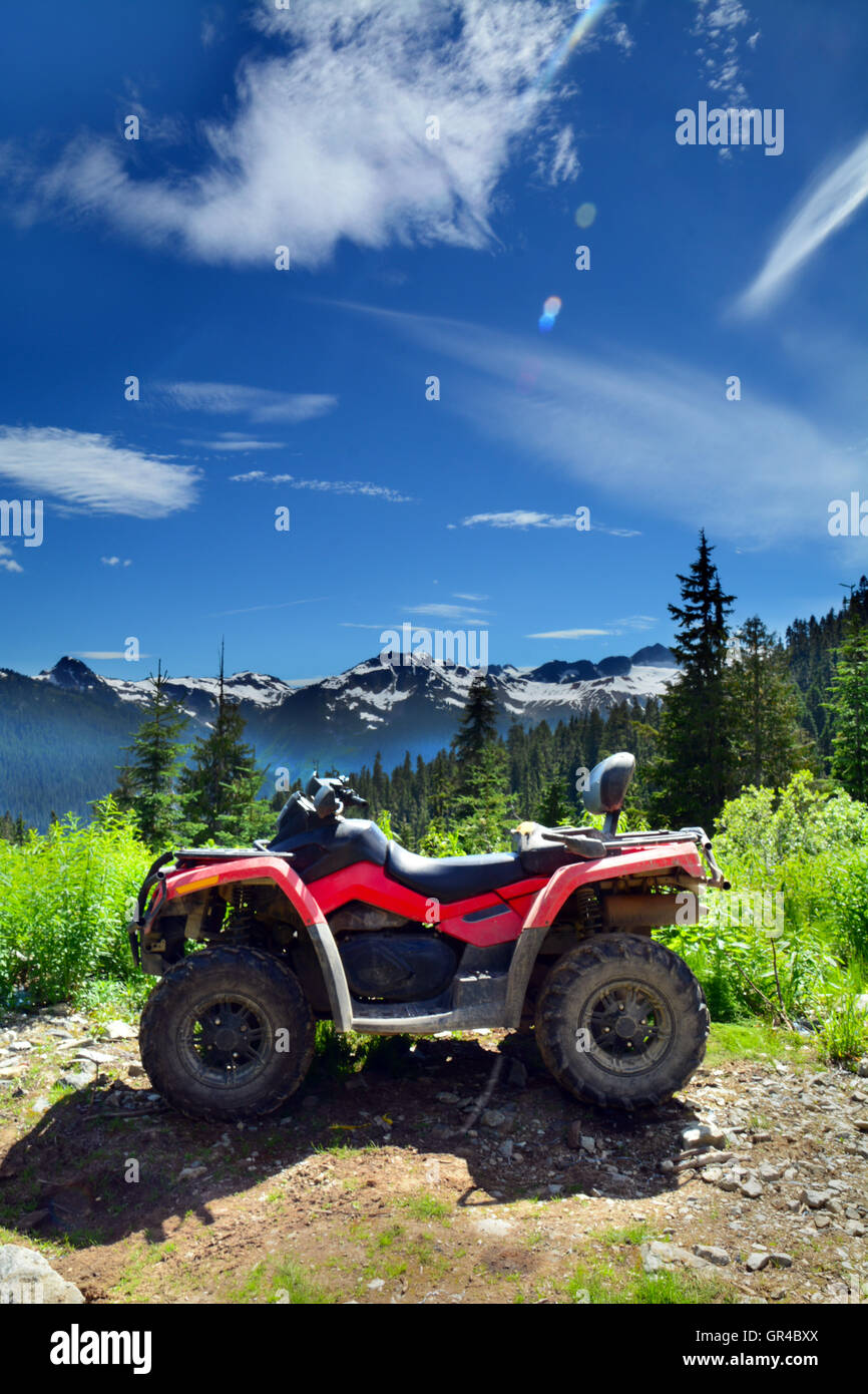 Red & Black ATV (All-Terrain Vehicle) Parked on Mountainous Forest ...