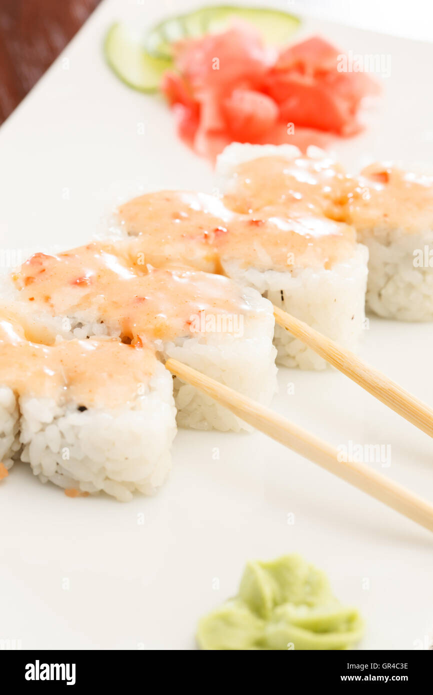 sushi with chopsticks Stock Photo - Alamy
