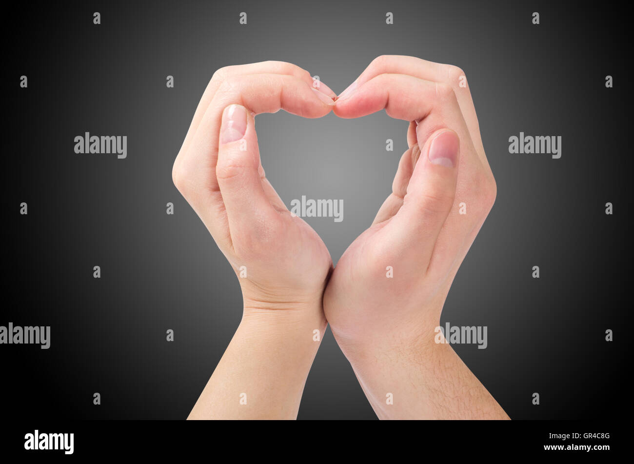 Two hands form a heart shape Stock Photo - Alamy
