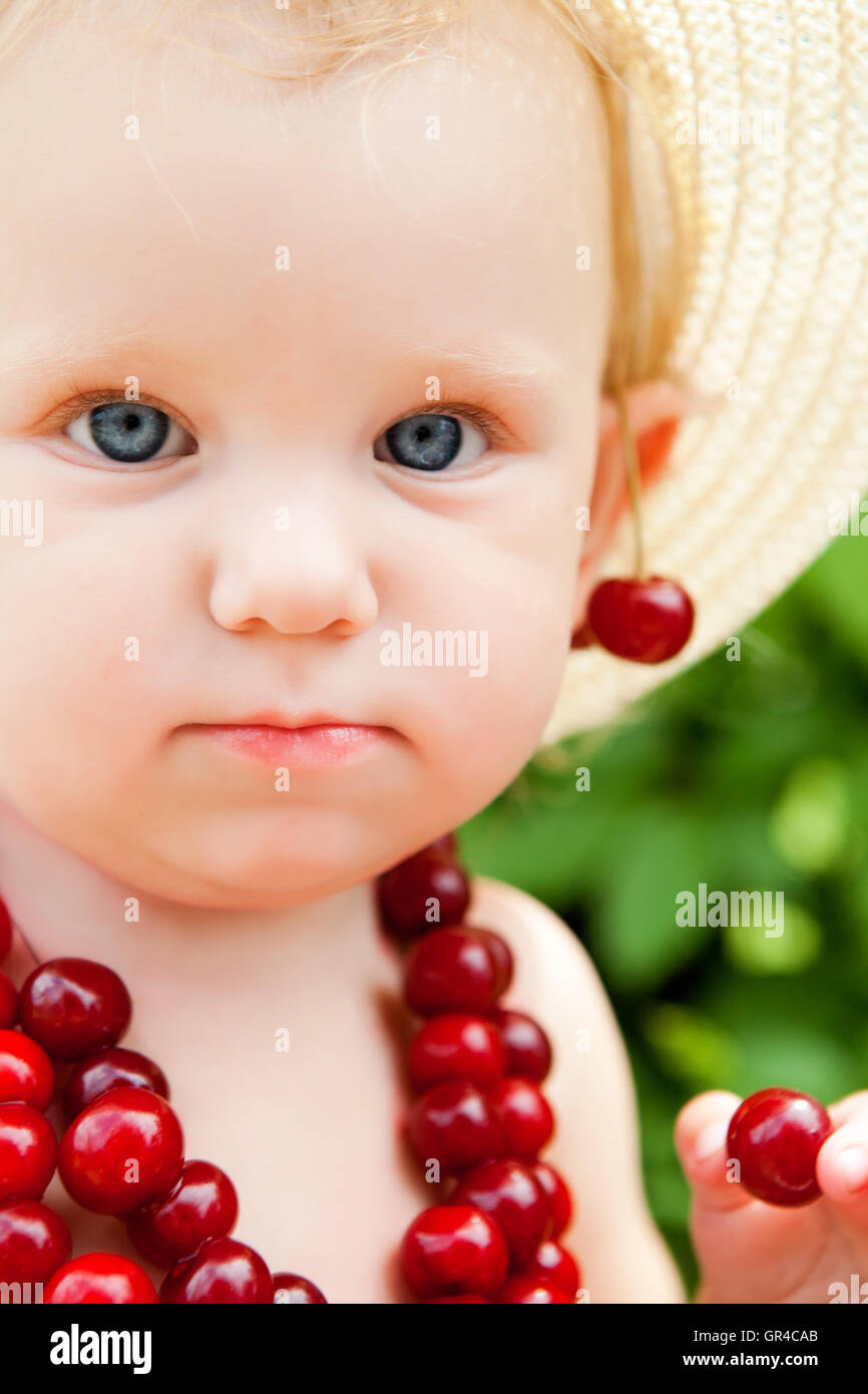 child with cherry beads Stock Photo - Alamy