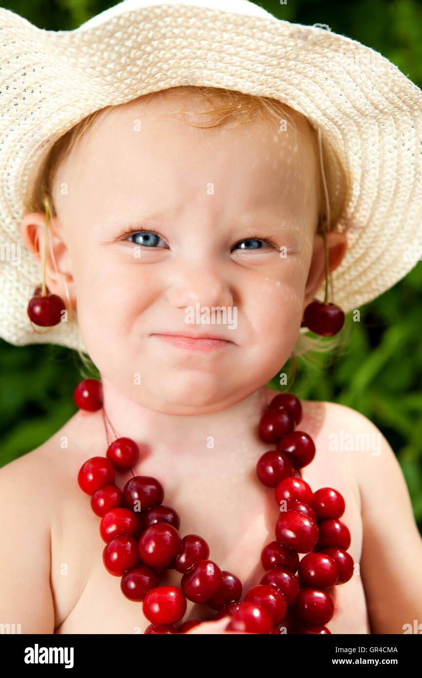 child with cherry beads Stock Photo - Alamy