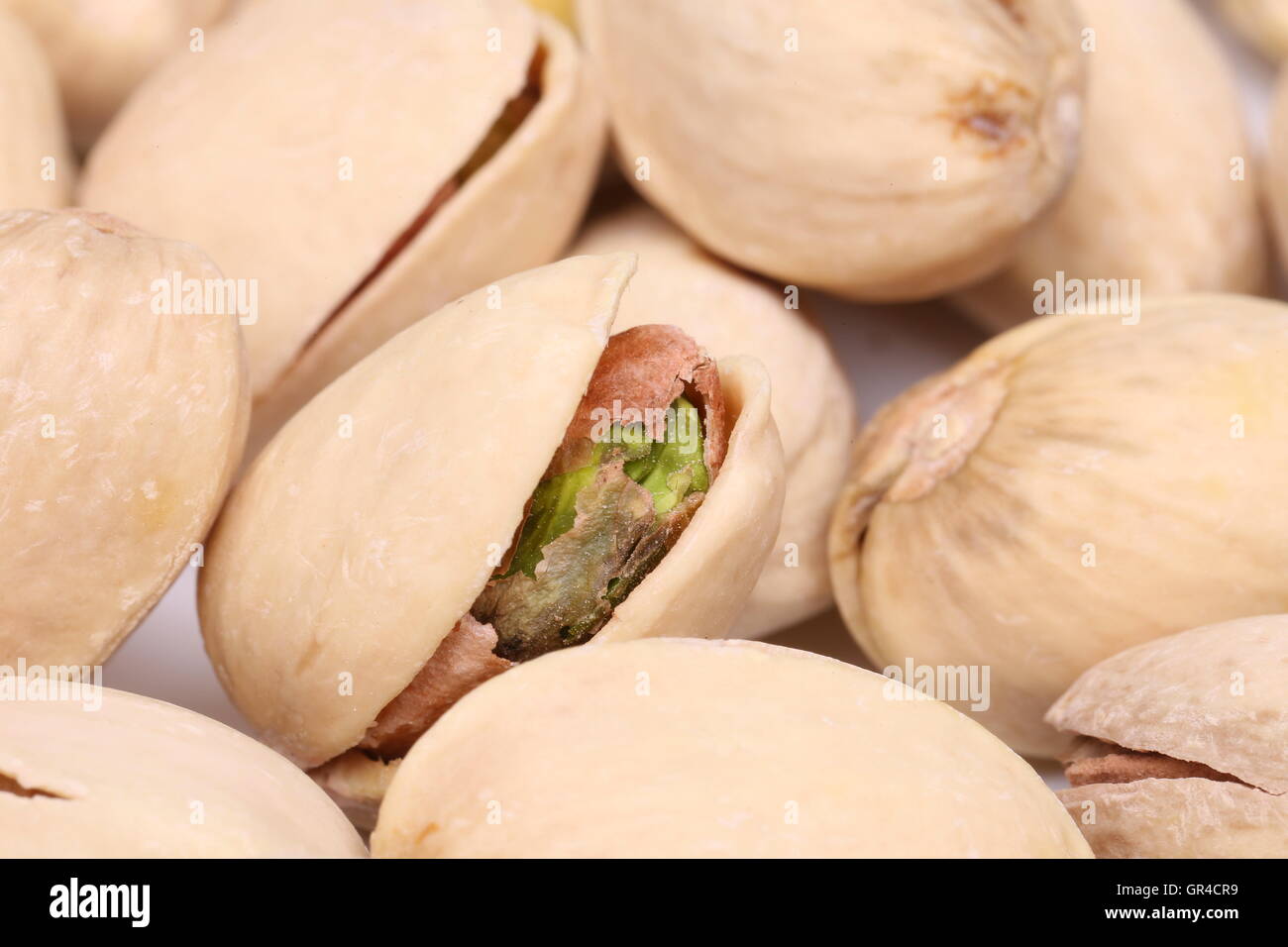 Wallpaper of one open pistachio Stock Photo - Alamy