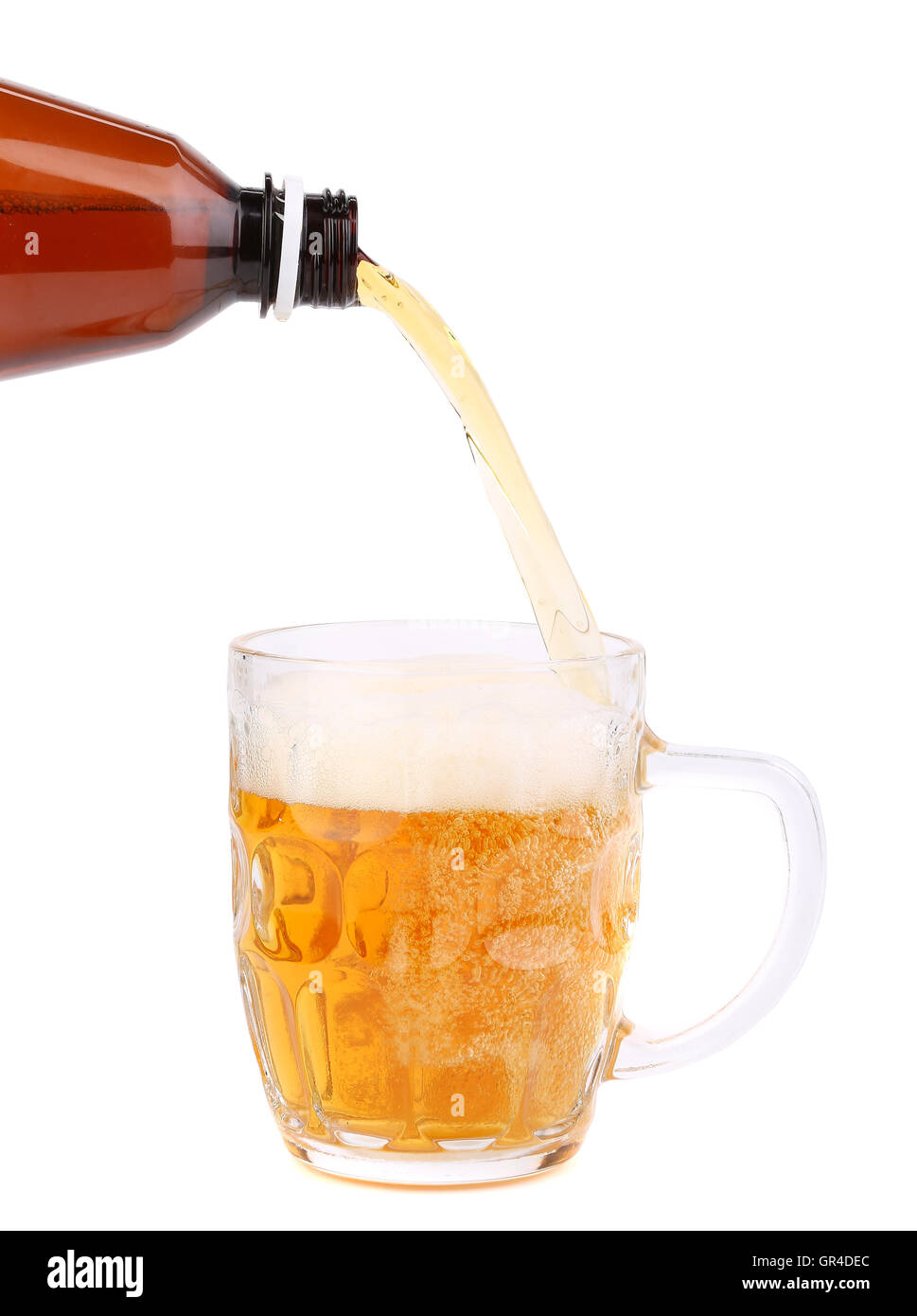 Close up of bottle of beer pouring into a mug Stock Photo - Alamy