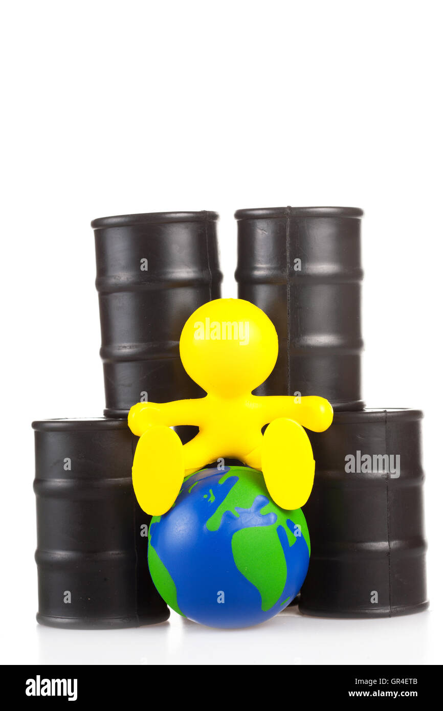 toy little man sits next on butts to oil the globe. The world supremacy ...