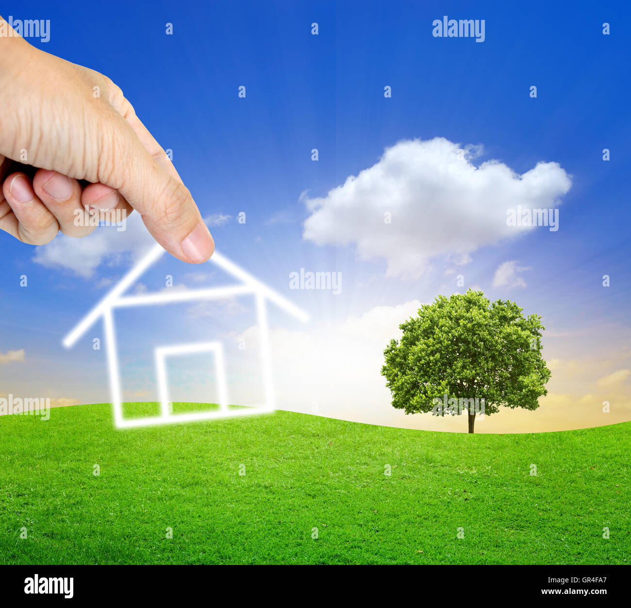 Human hand fill home on the beautiful land Stock Photo - Alamy
