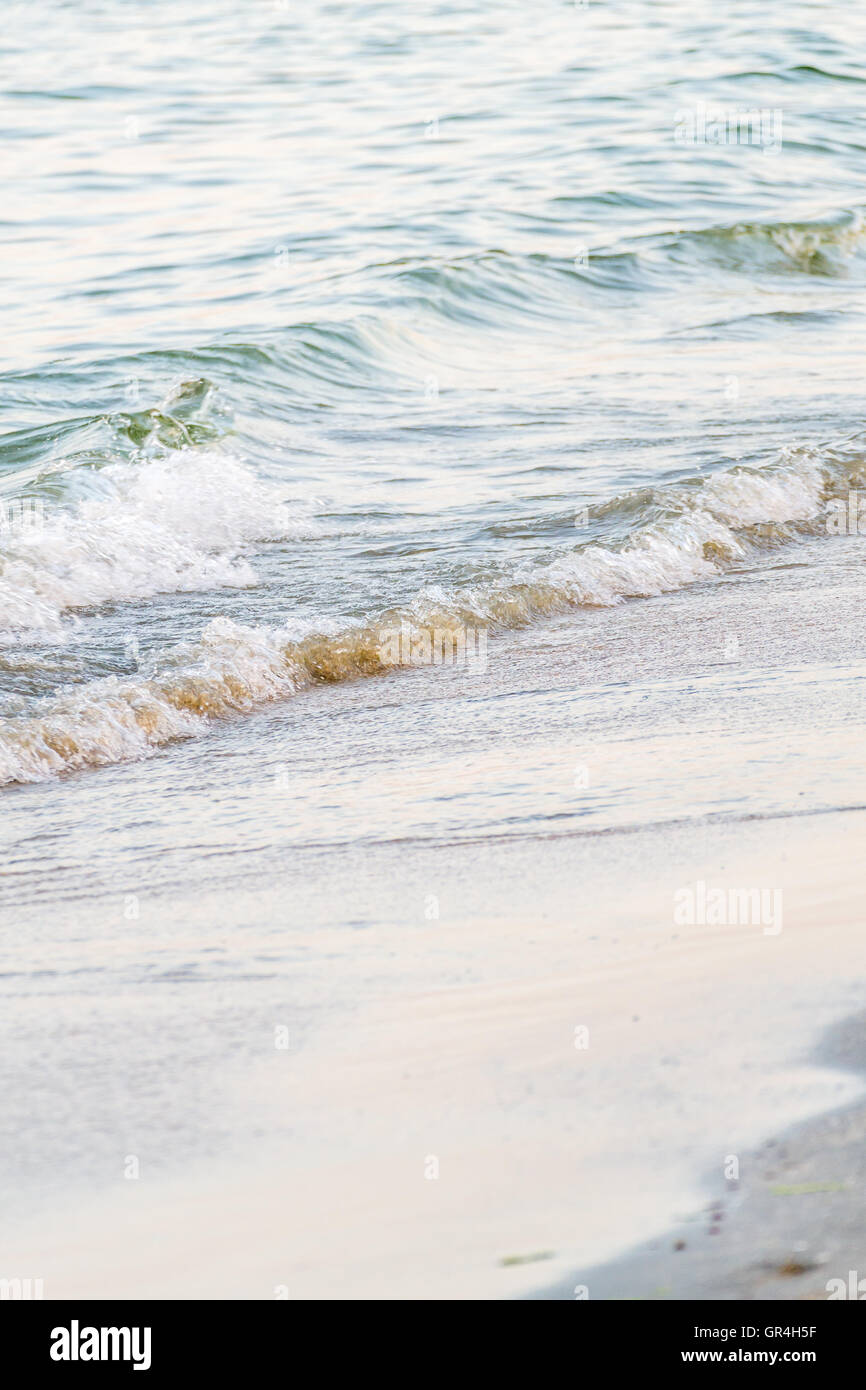 Water hitting shore Stock Photo - Alamy