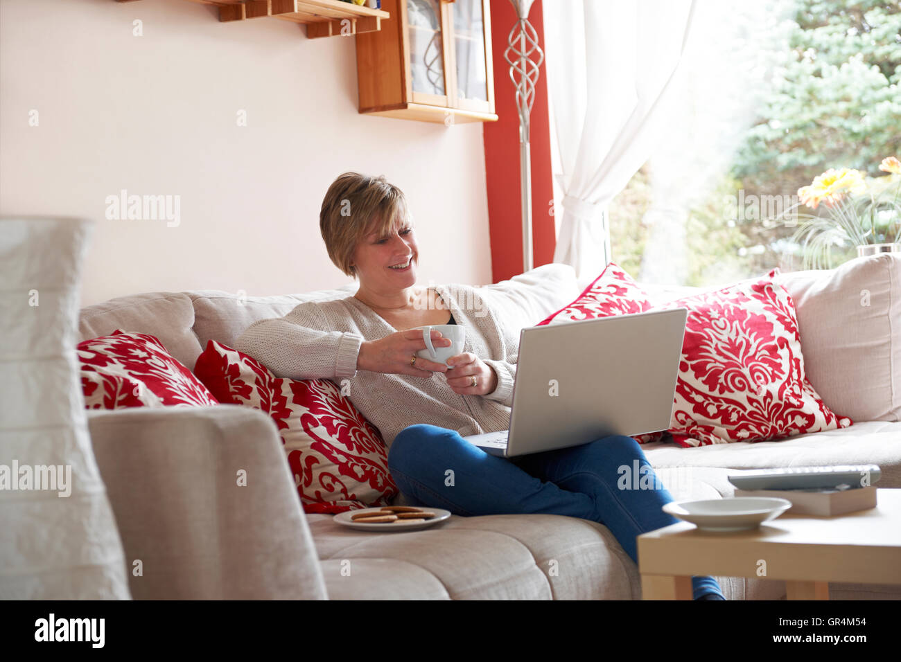 Mum watching computer hi-res stock photography and images - Alamy