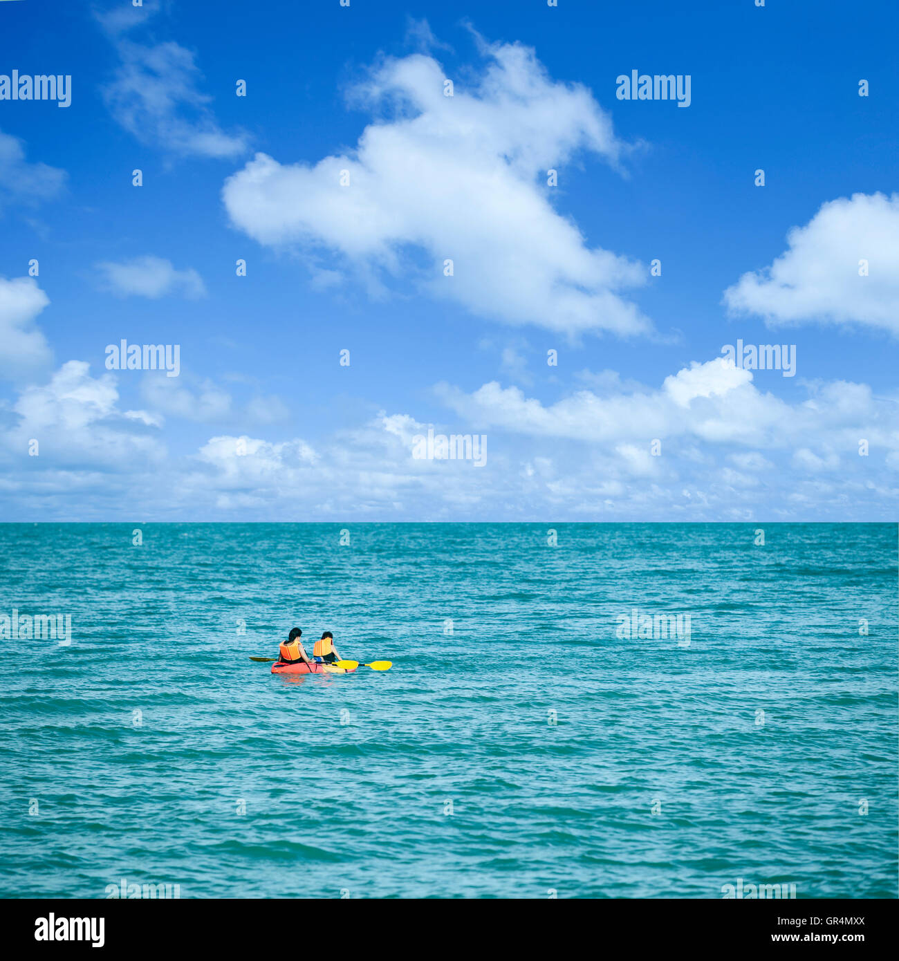 traveler kayaking in the sea with beautiful blue sky Stock Photo - Alamy