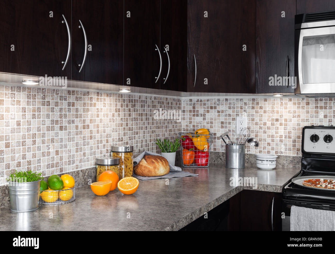 Contemporary kitchen with food ingredients on countertop Stock Photo ...