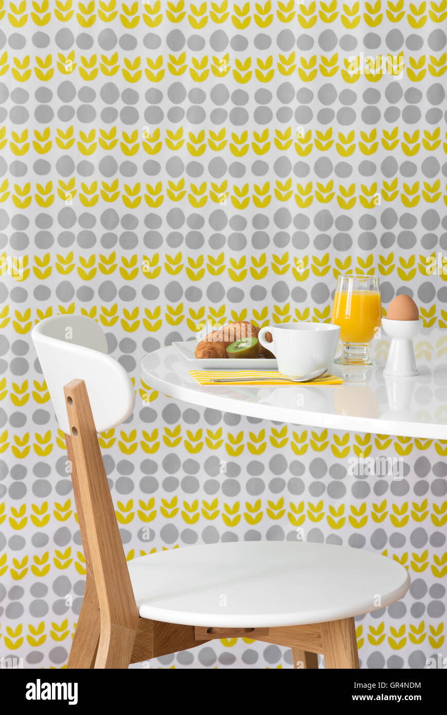 Modern table and chair on bright background Stock Photo - Alamy