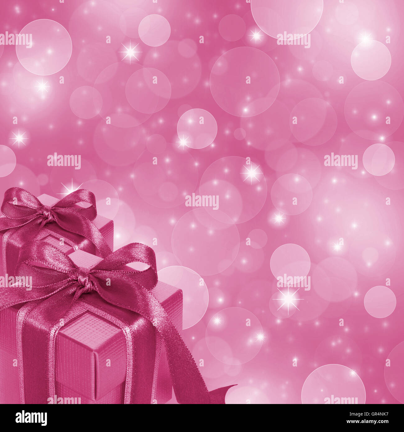 Pink gift boxes on abstract pink glitter background Stock Photo - Alamy