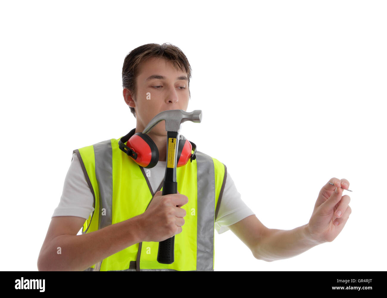 Teen apprentice with hammer and nail Stock Photo - Alamy