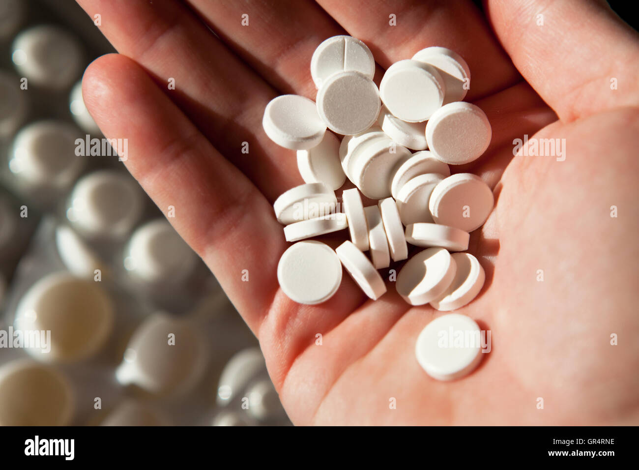 tablets in hand Stock Photo - Alamy