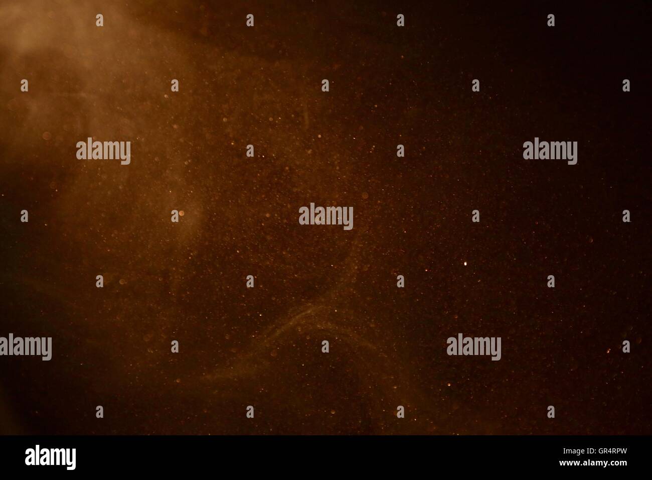 Dust glimmering in a ray of sun Stock Photo - Alamy