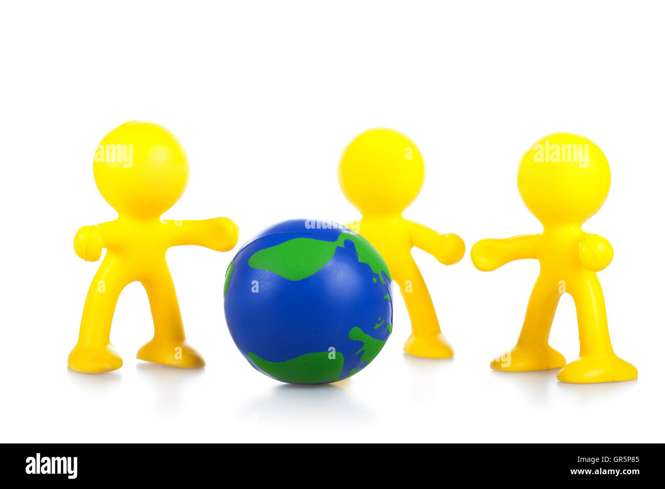 toy little men hold globe. It is isolated, a white background Stock ...