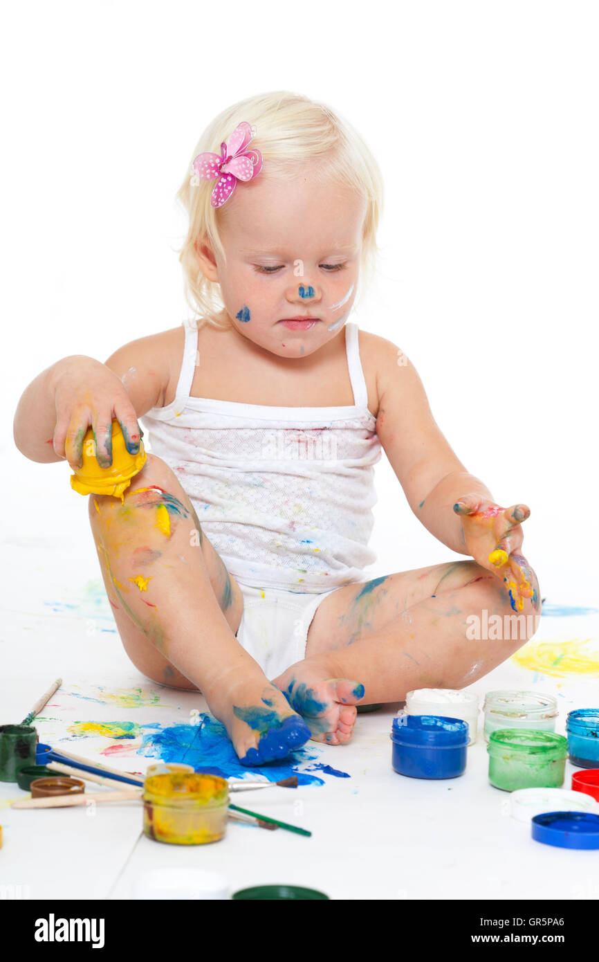 Little Girl Bedaubed With Bright Colors Stock Photo Alamy