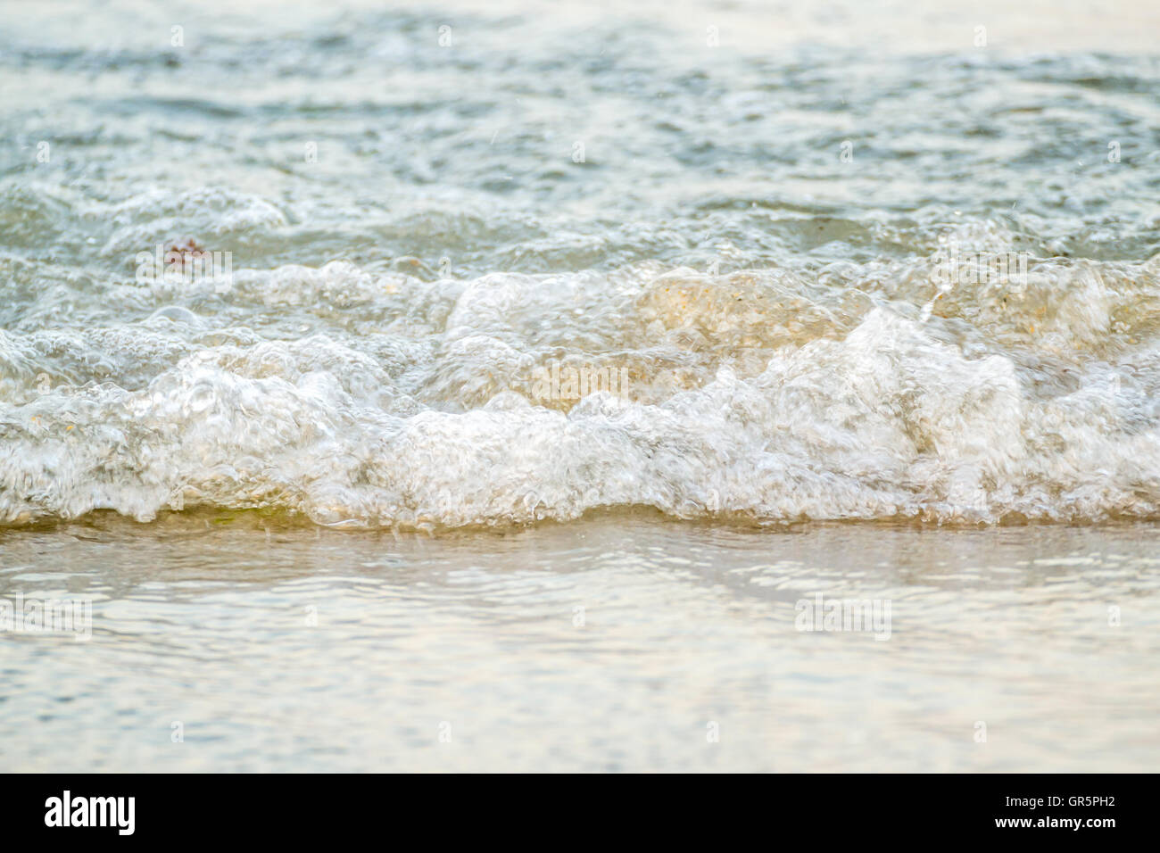 Water hitting shore Stock Photo - Alamy