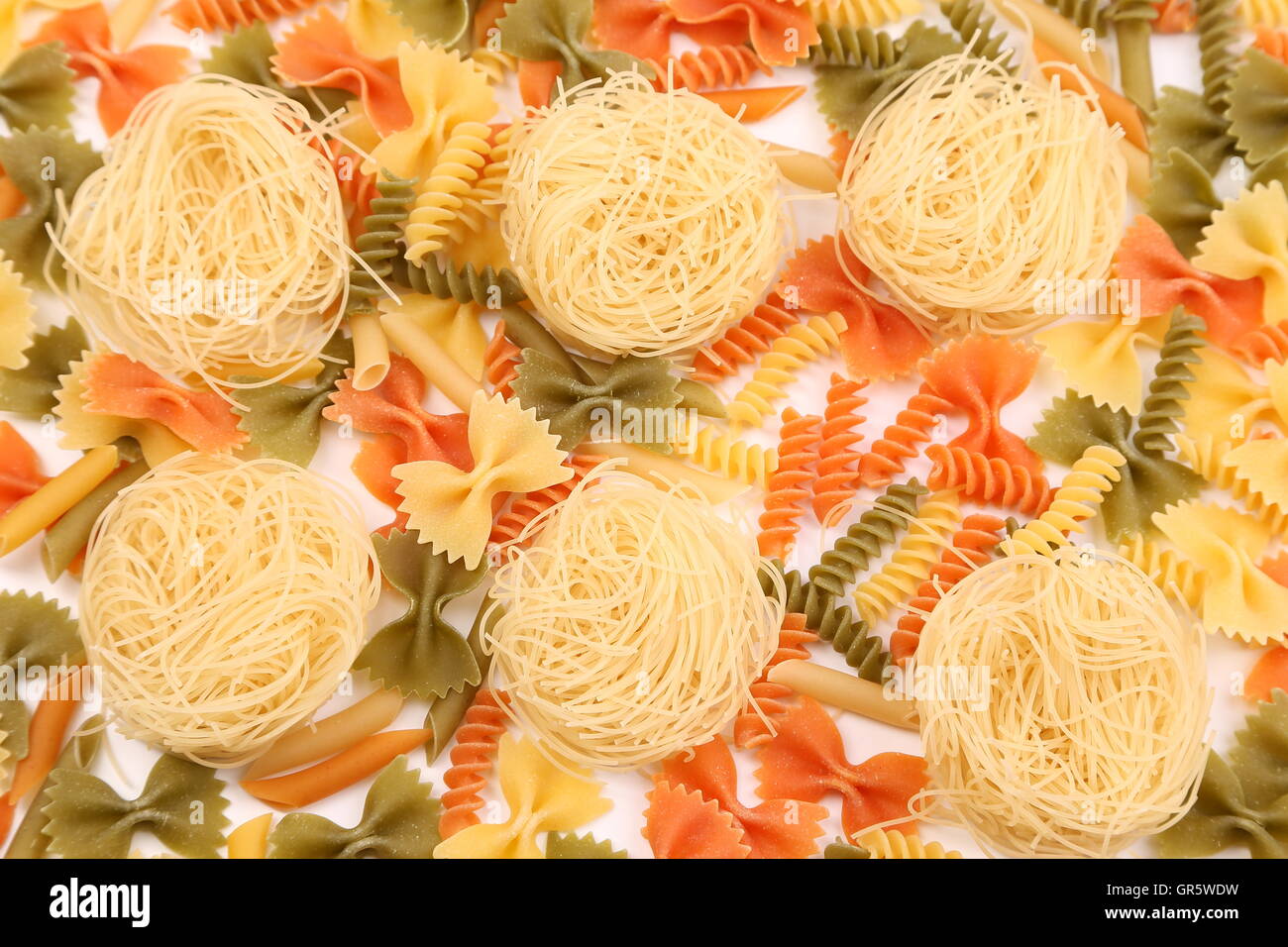 A different pasta in three colors Stock Photo - Alamy