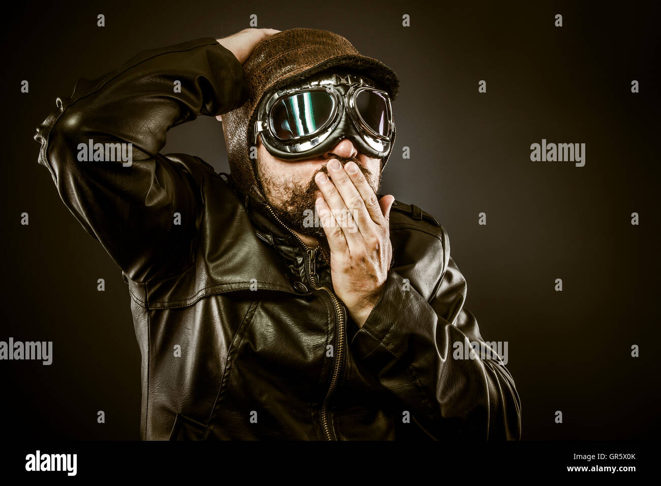 Surprised fighter pilot with hat and glasses era Stock Photo - Alamy