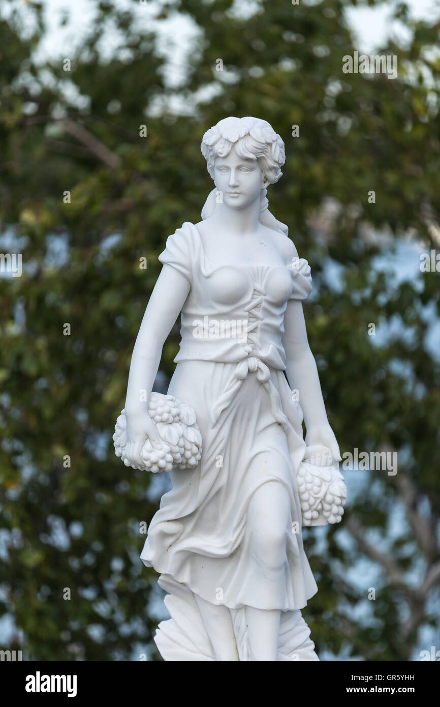 Statue of a beautiful woman in summer Stock Photo - Alamy