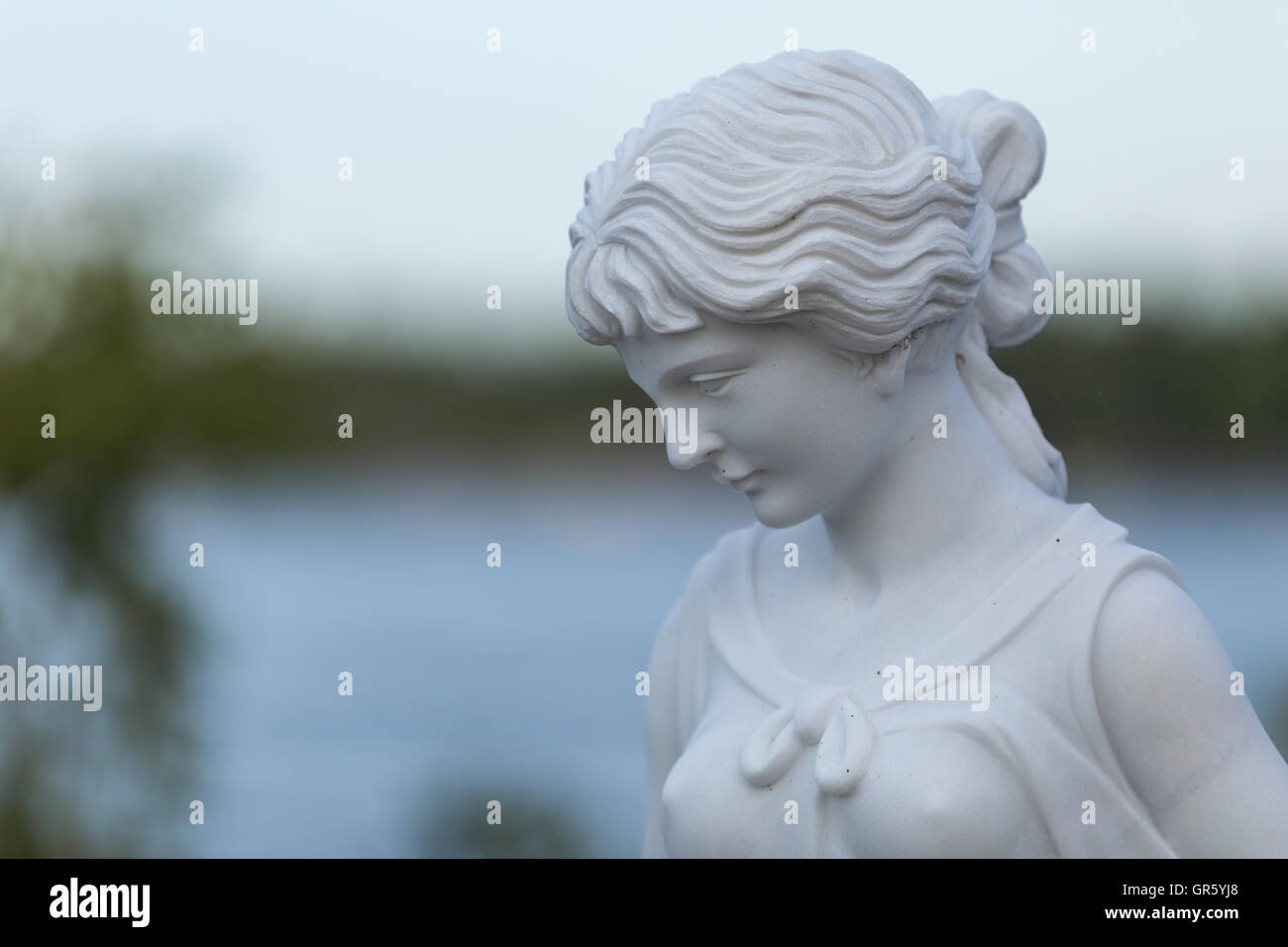 Statue of a beautiful woman in summer Stock Photo - Alamy
