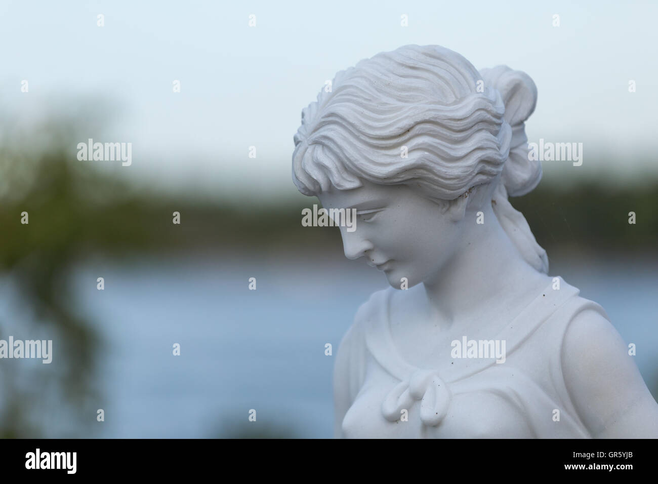 Statue of a beautiful woman in summer Stock Photo - Alamy