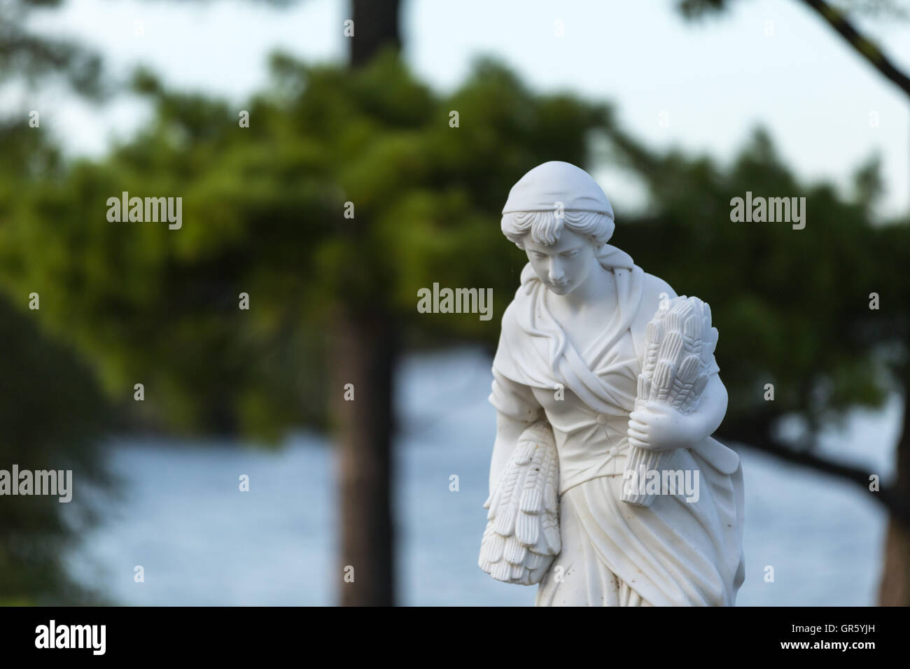 Statue of a beautiful woman in summer Stock Photo - Alamy