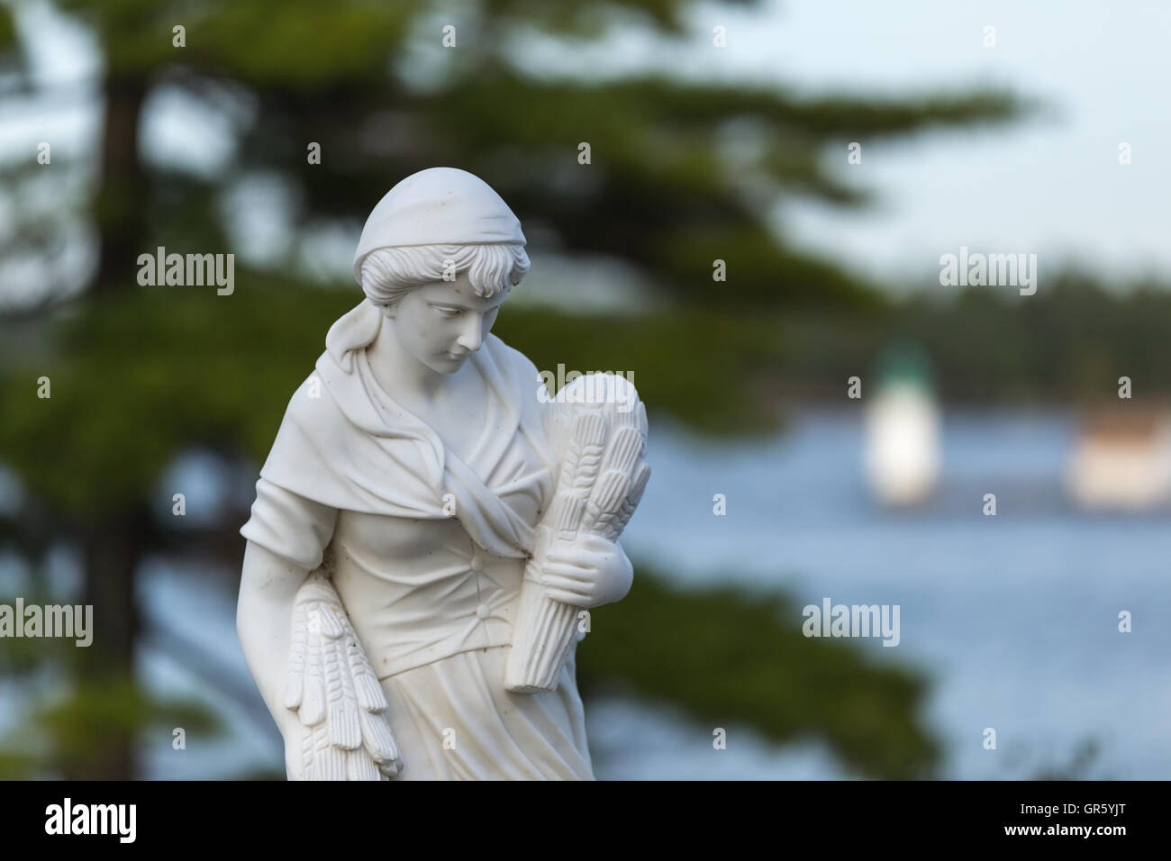 Statue of a beautiful woman in summer Stock Photo - Alamy